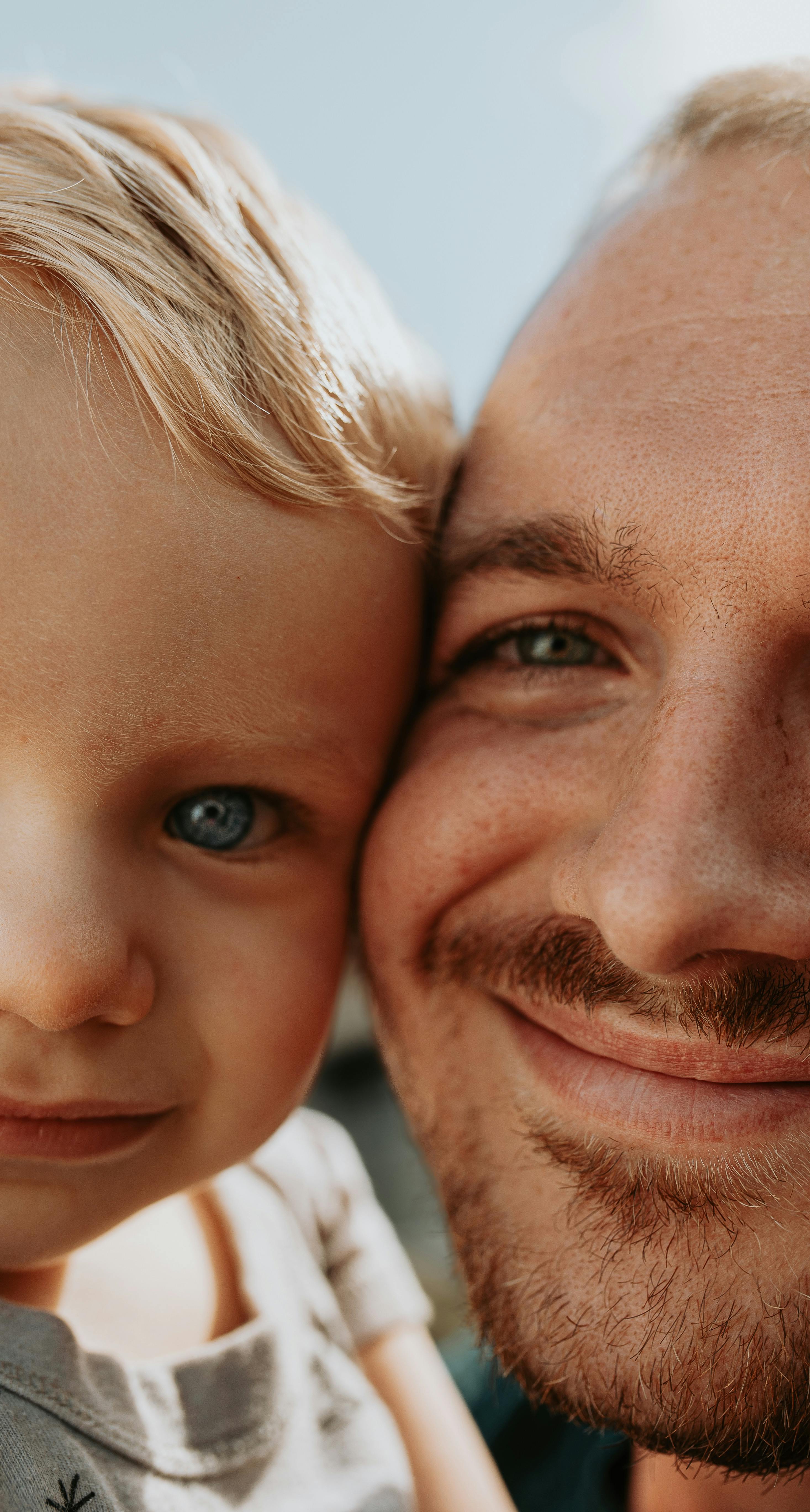 Close-up of a Father Holding His Baby and Smiling · Free Stock Photo