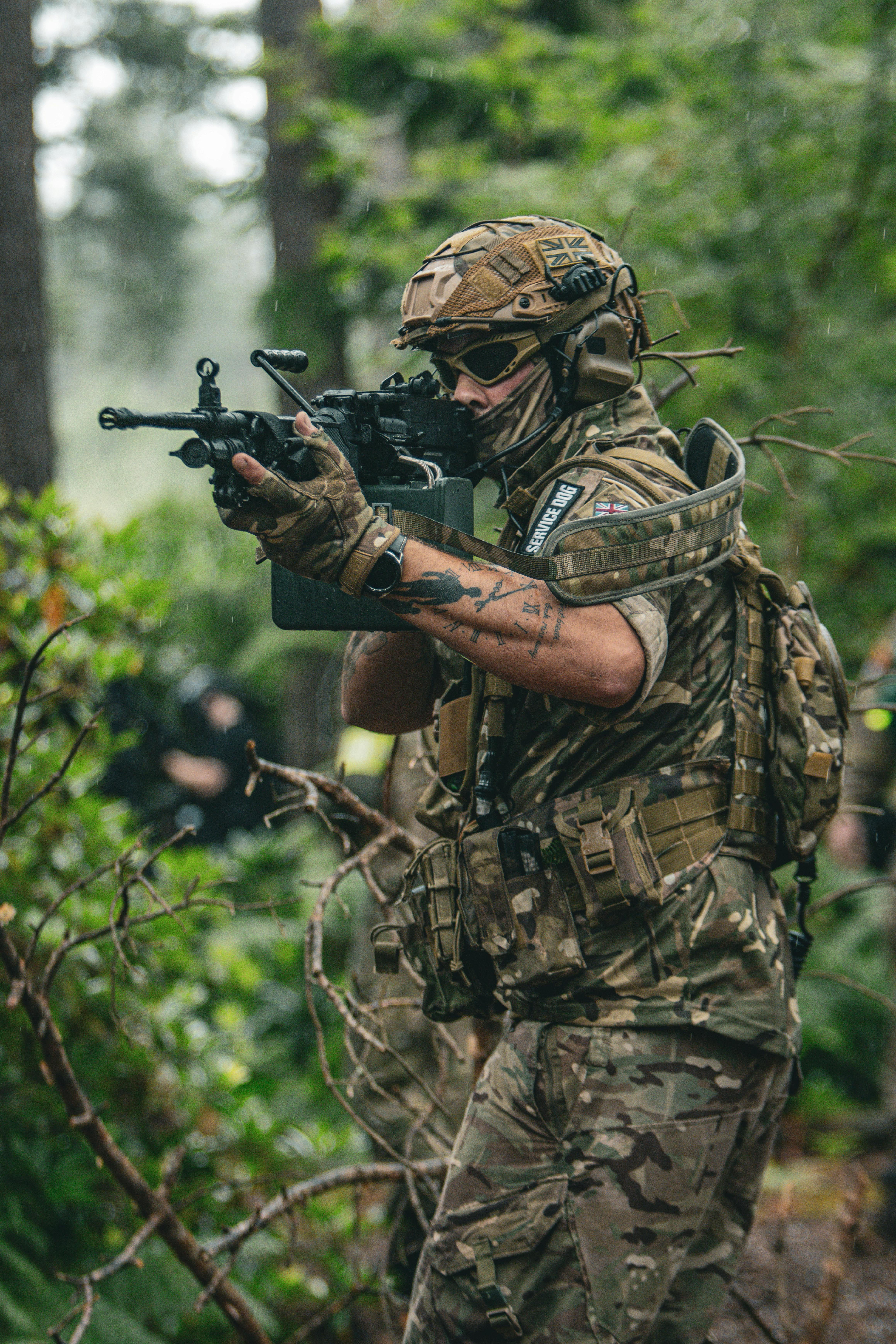 Soldier Man With Black Rifle Sliding on Cliff · Free Stock Photo