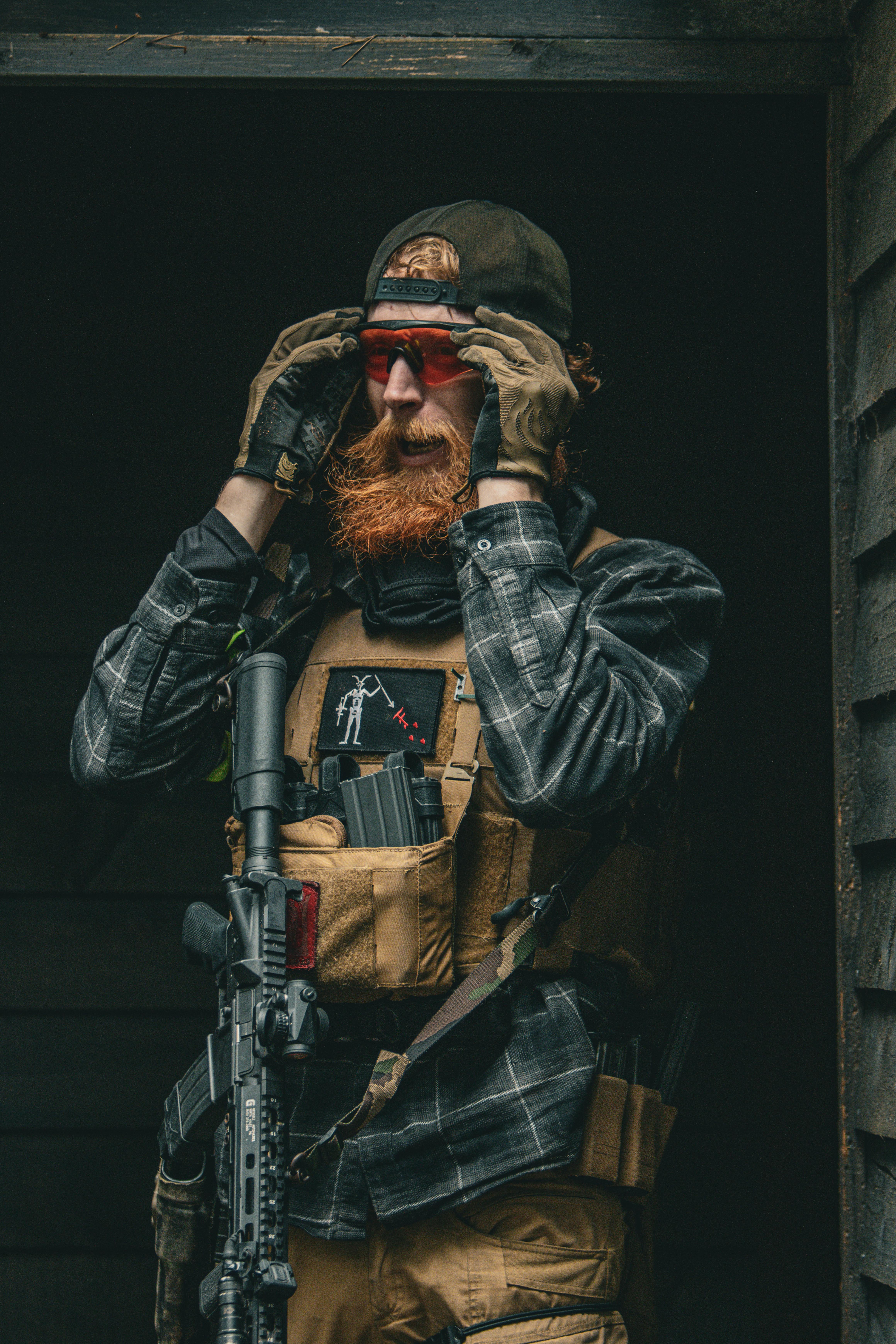 Gangster Posing with Machine Gun by Saloon Door · Free Stock Photo