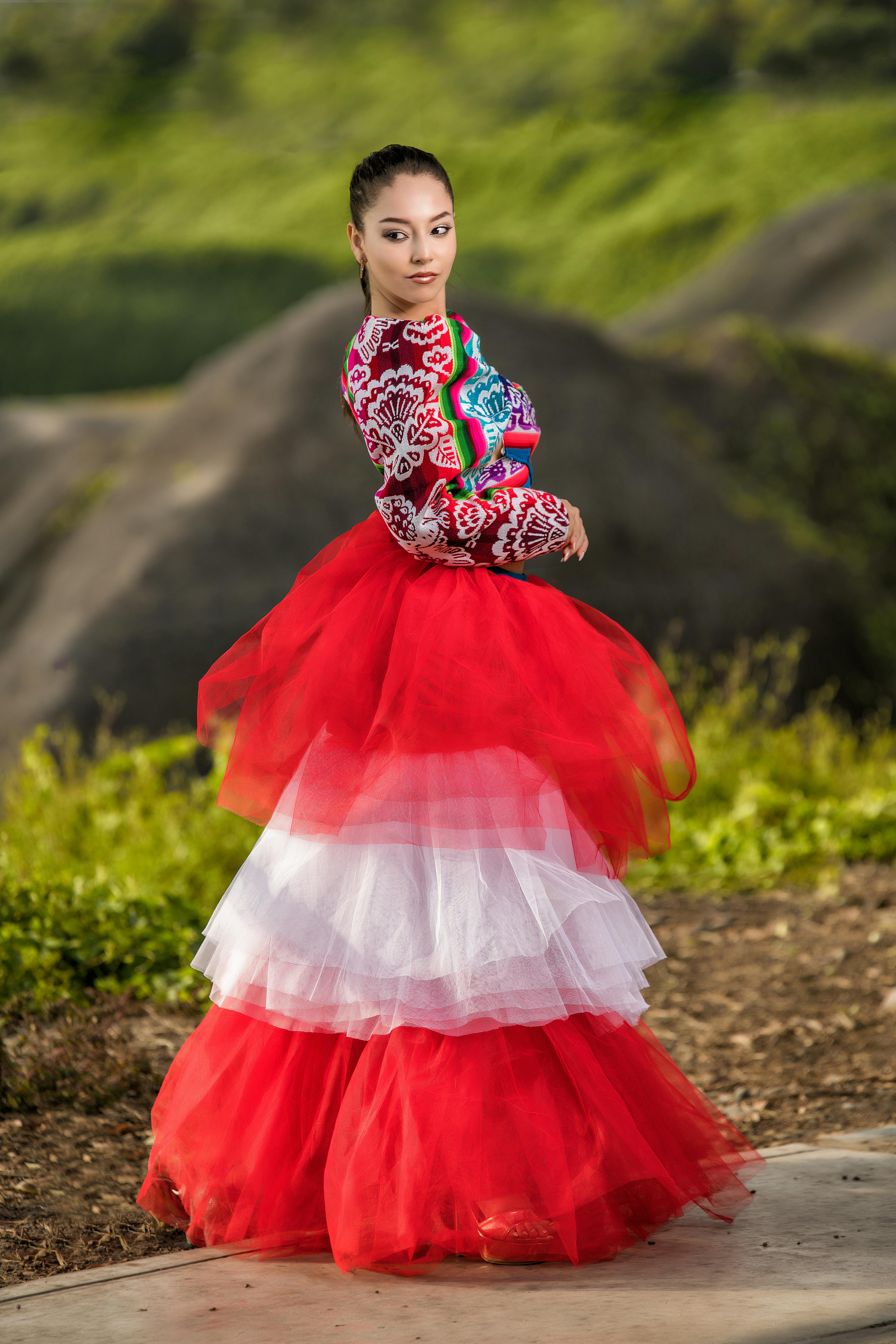 Woman in Traditional Dress Stand on Walkway · Free Stock Photo