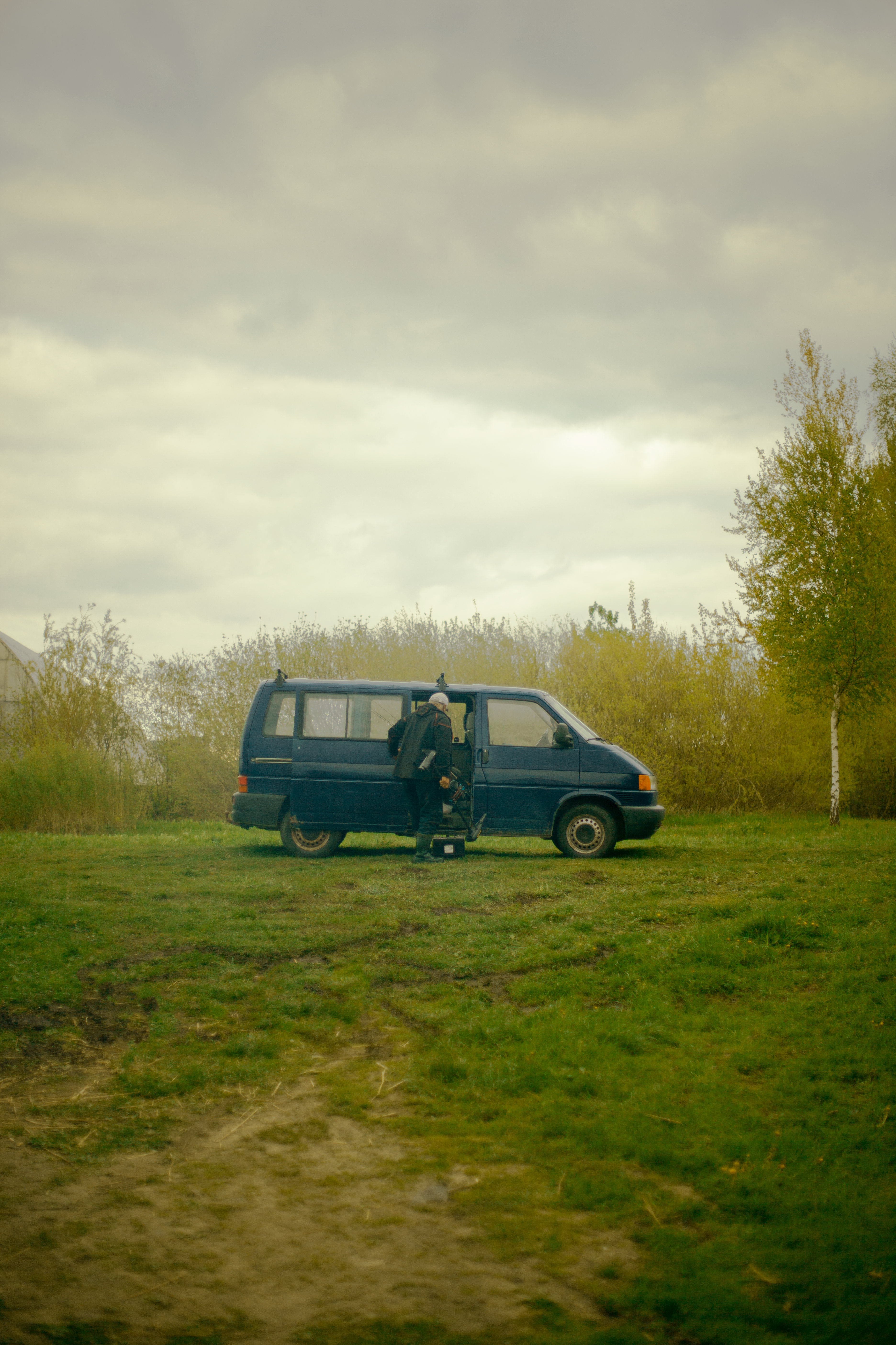 Man Getting on a Green Van · Free Stock Photo