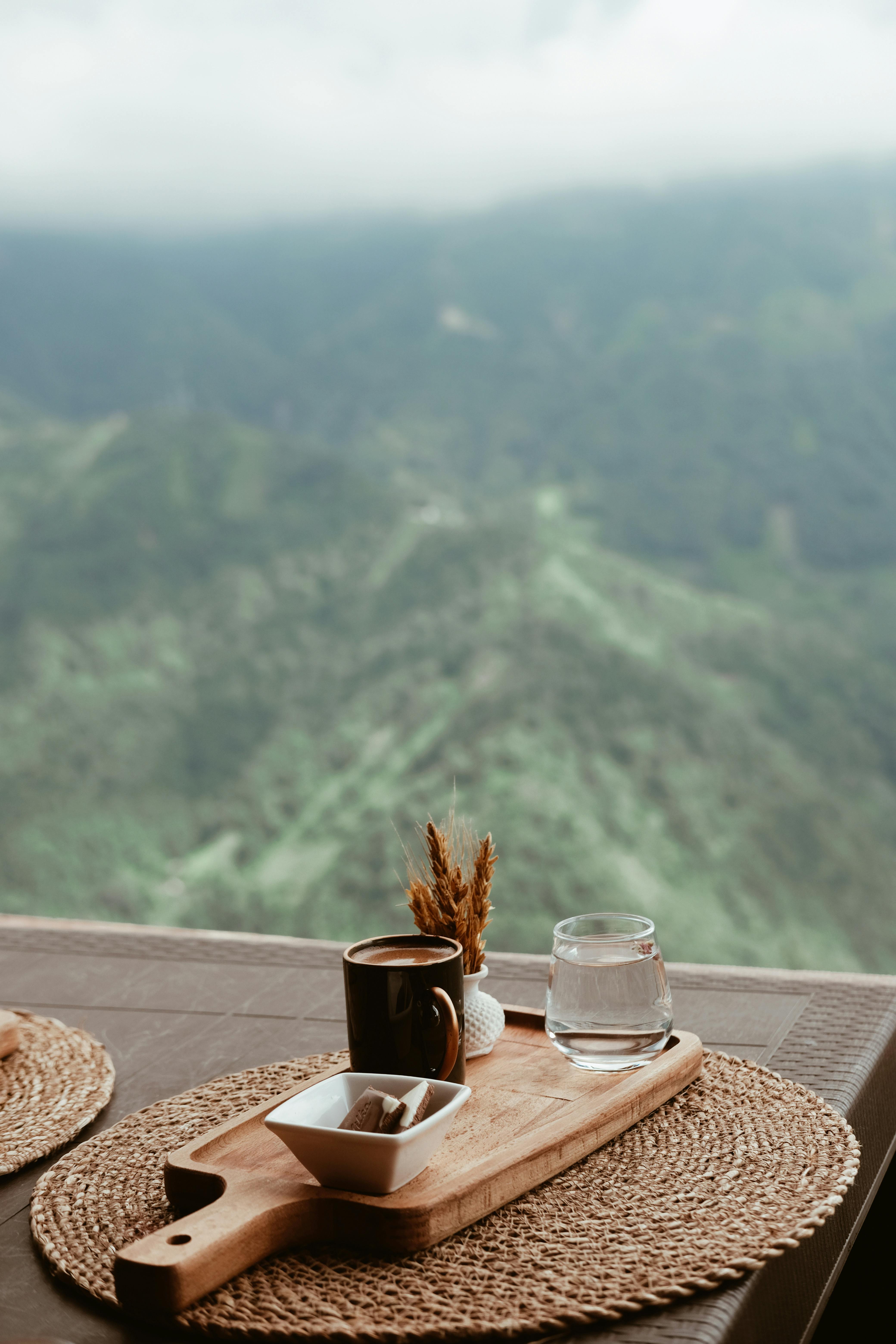 A Coffee on the Table in a Cafe with the View of Mountains · Free Stock ...