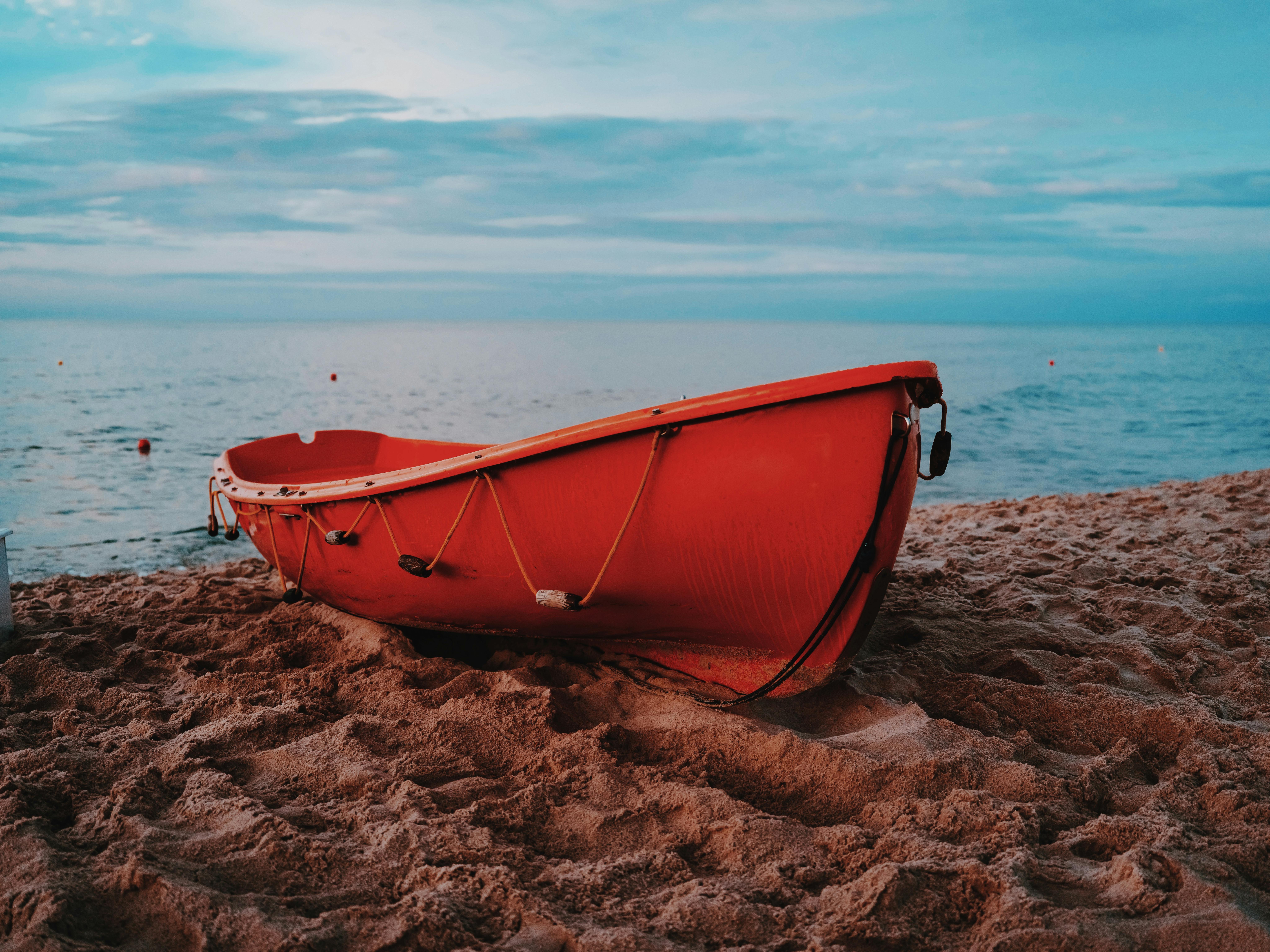 Red Boat on a Beach · Free Stock Photo