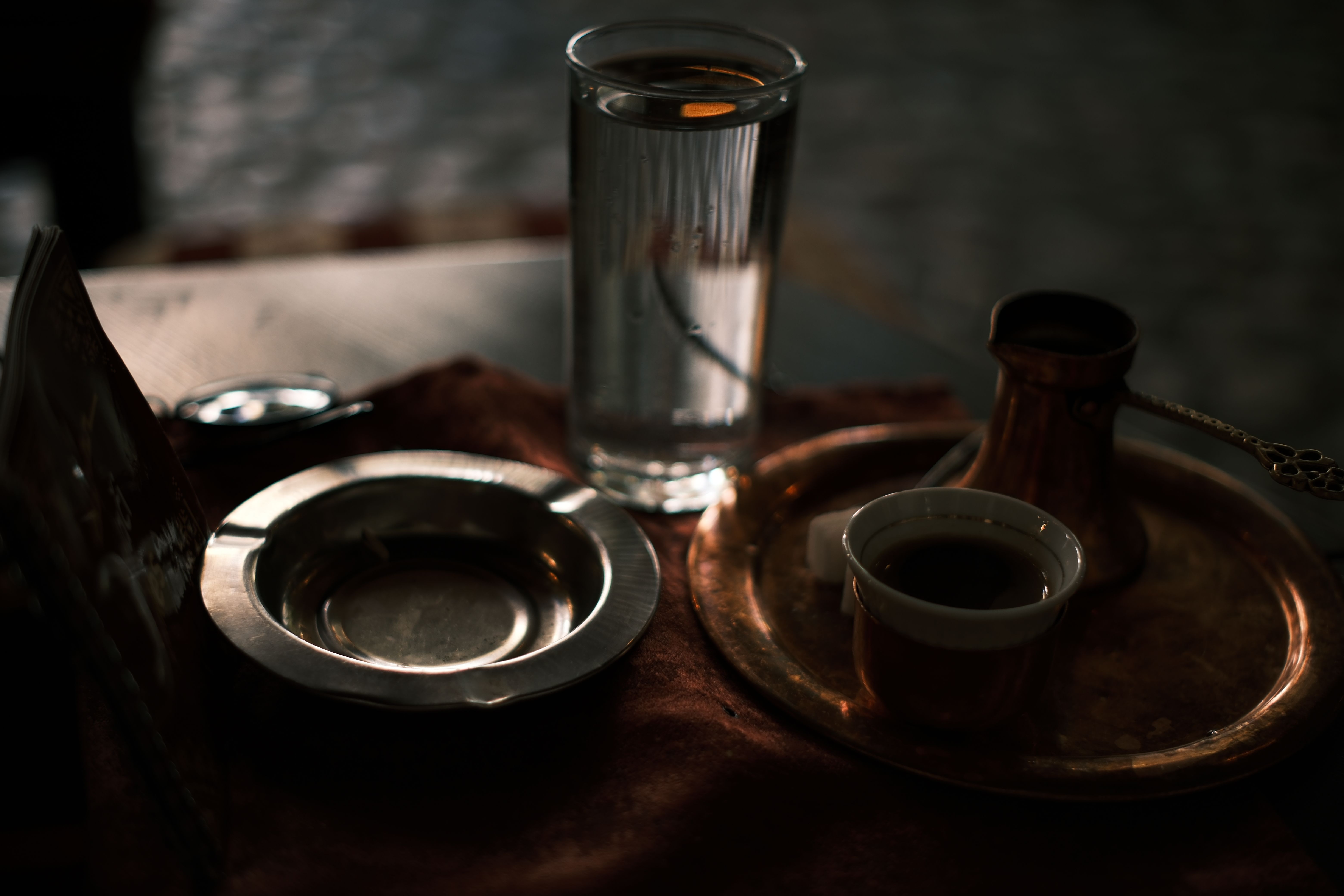 Cup of Coffee and Glass of Water on a Table of a Street Cafe · Free ...