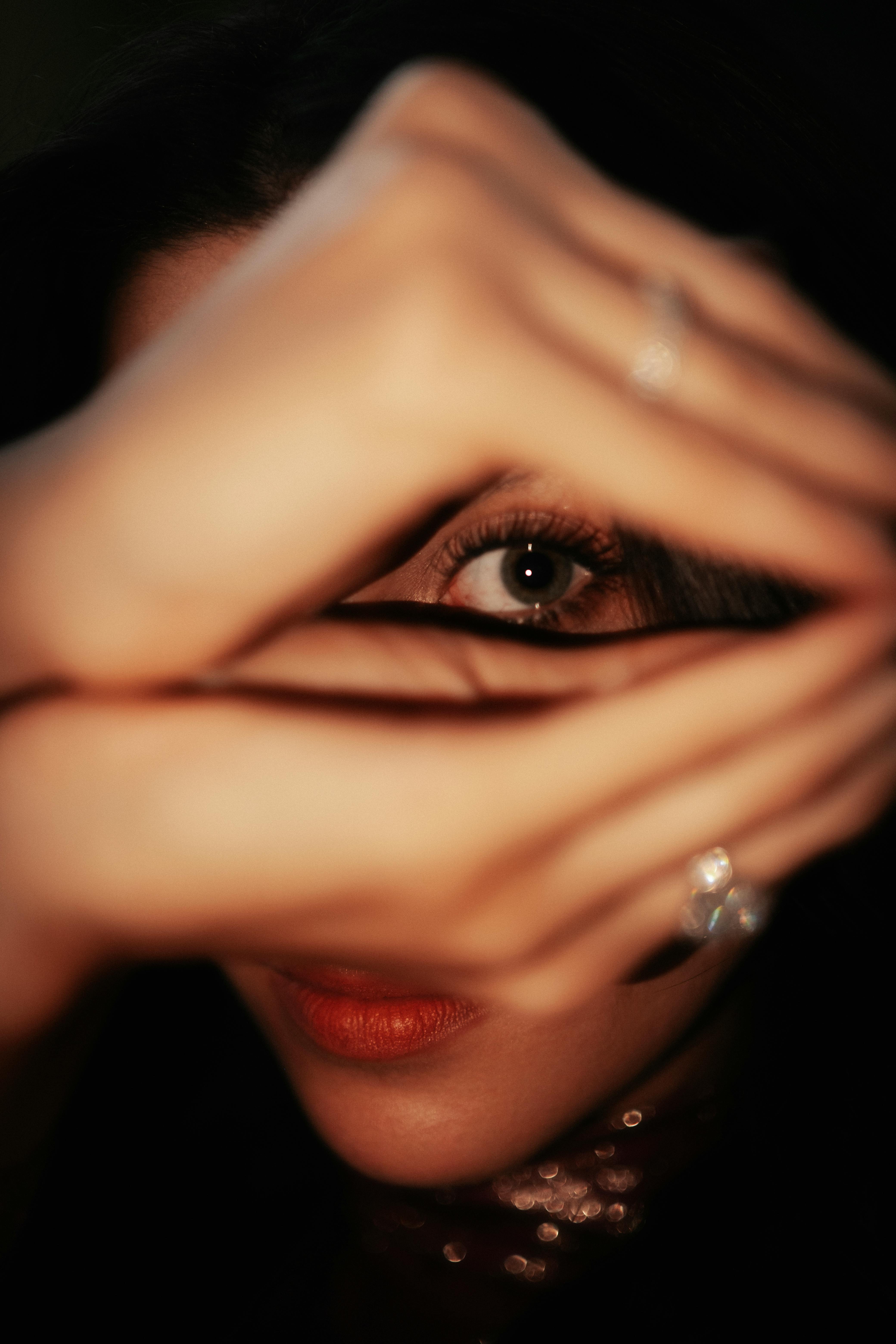 Woman Eye behind Hands · Free Stock Photo