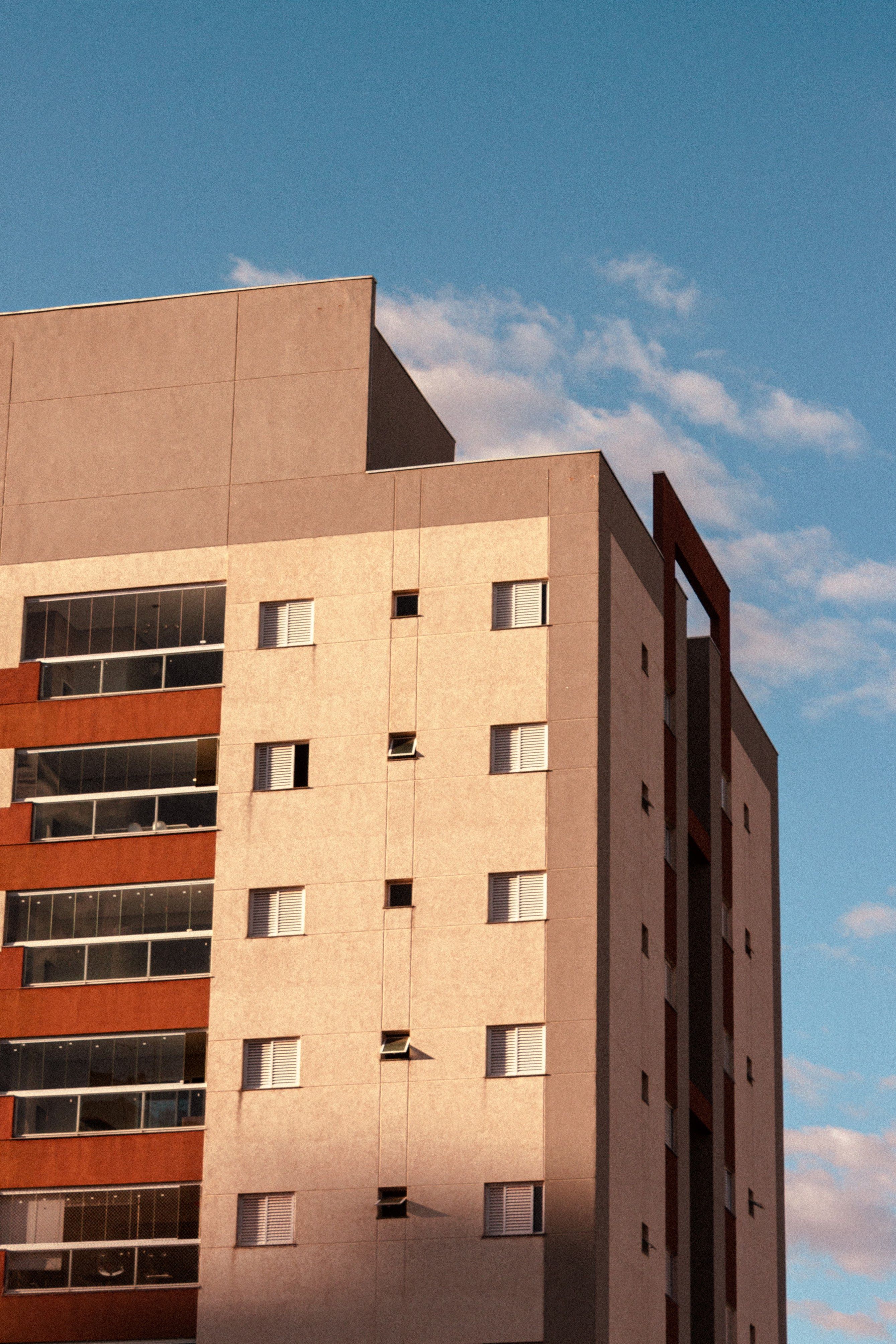 Person Hanging on a High Rise Building · Free Stock Photo