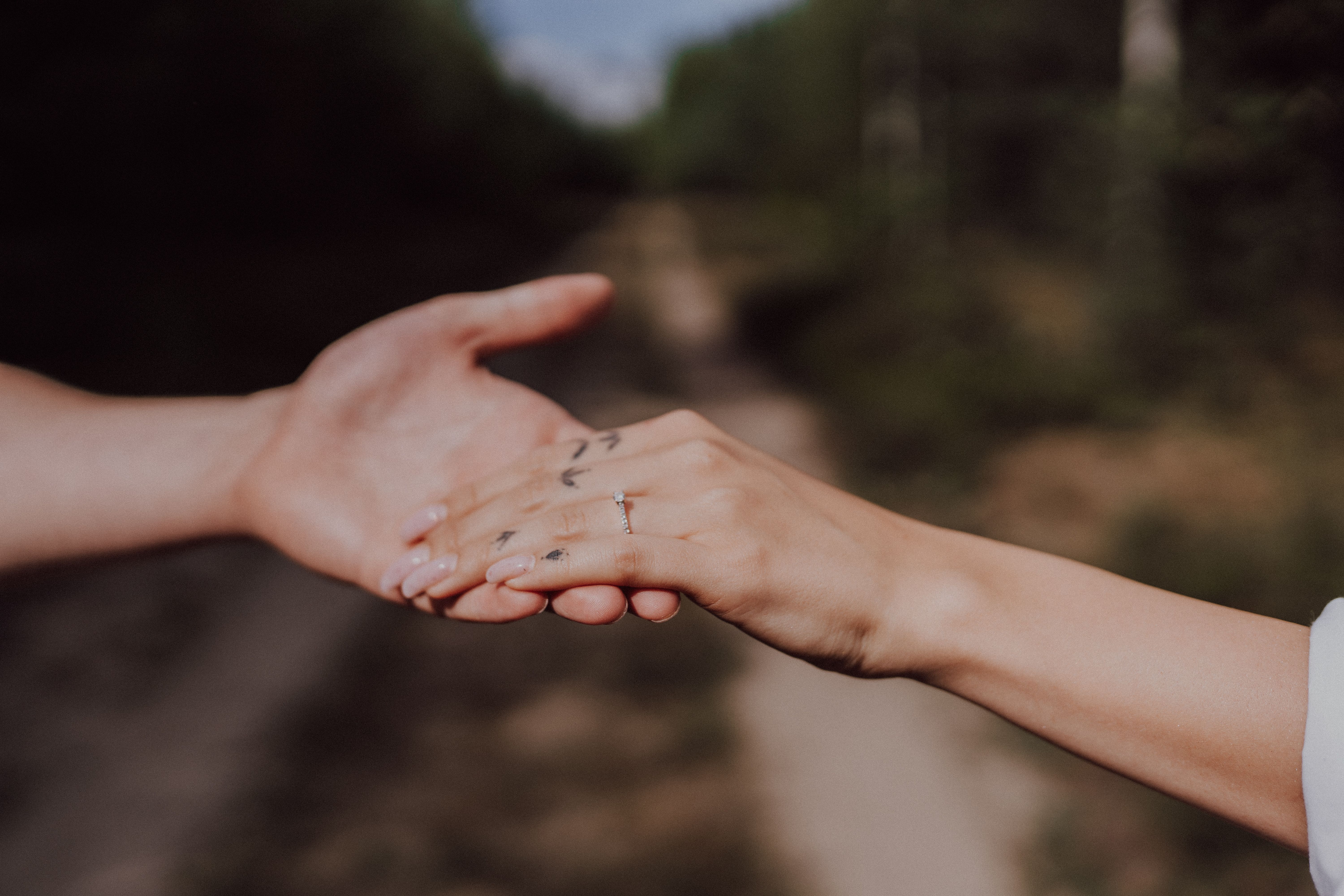Close-up of a Couple Holding Hands · Free Stock Photo