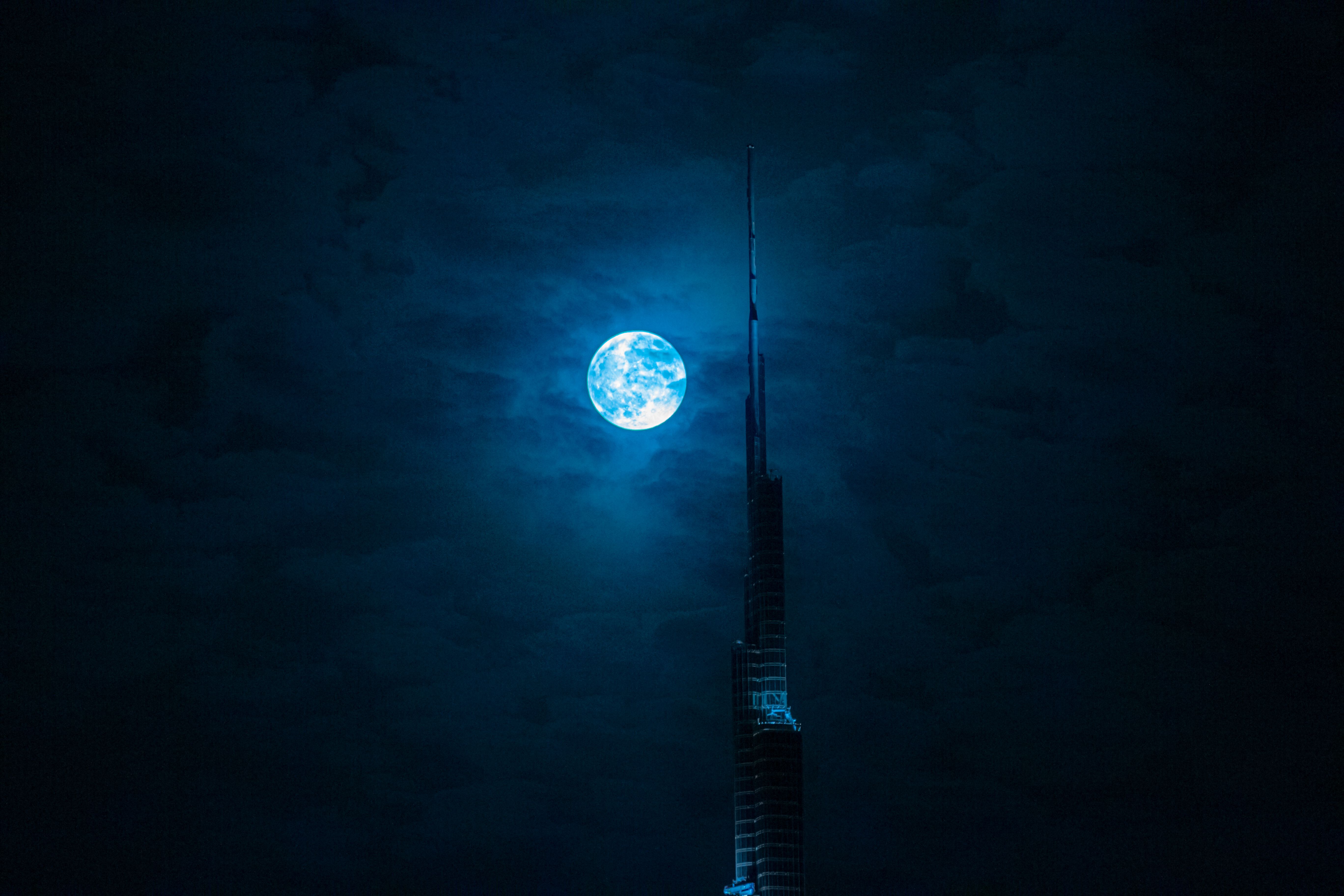 Full Moon and Burj Khalifa Spire on a Cloudy Night, Dubai, UAE · Free ...