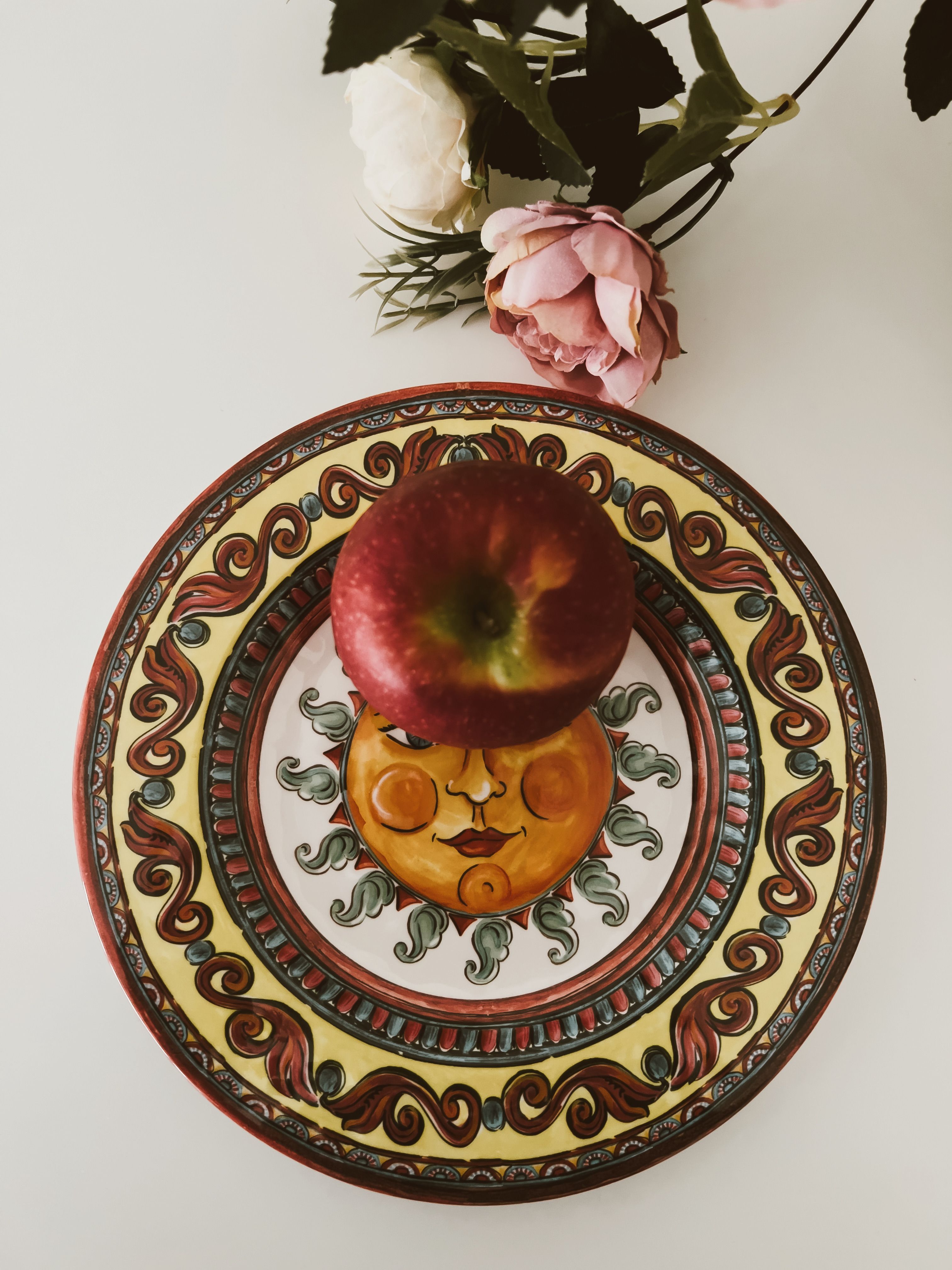 Apple on Decorated Plate · Free Stock Photo