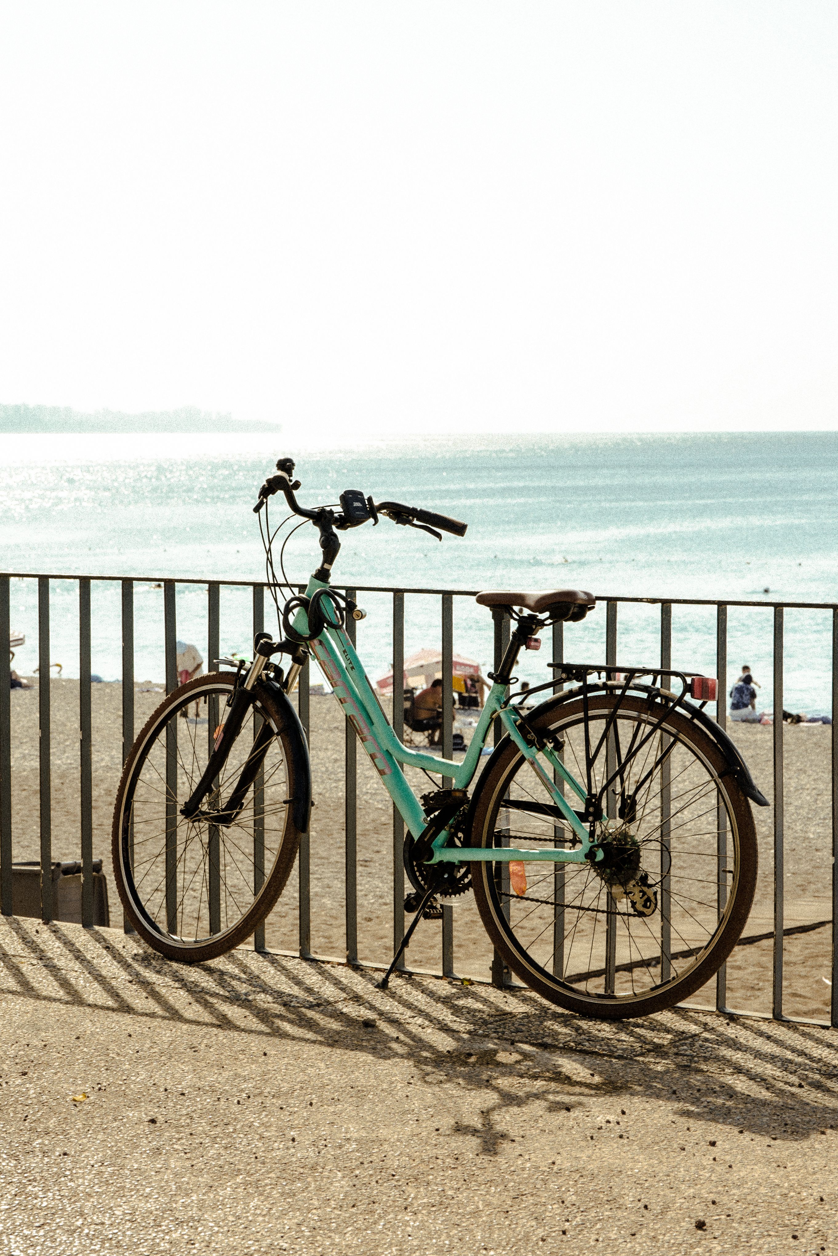 Bicycle by Railing on Sea Shore · Free Stock Photo