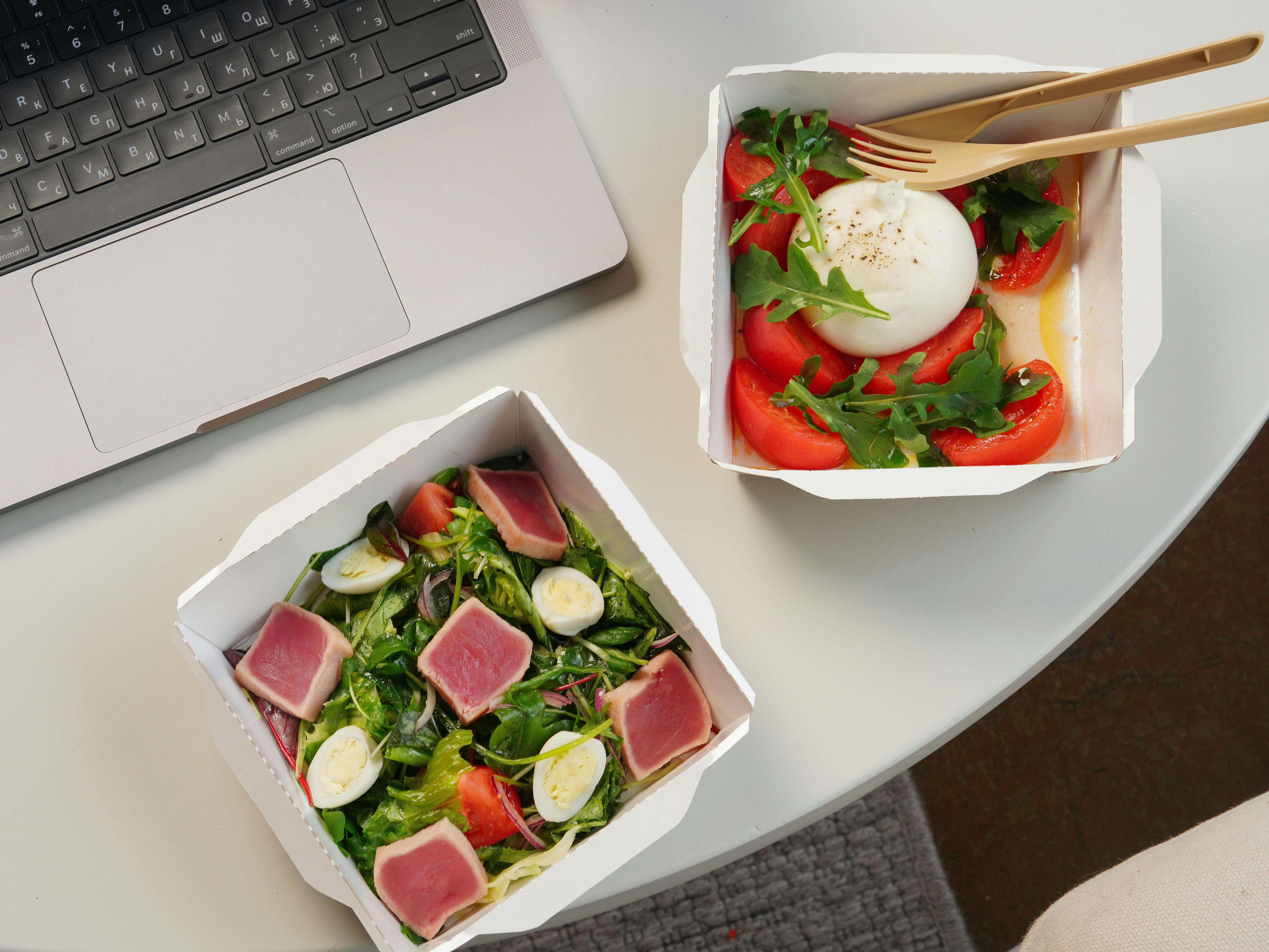 Salad in Box next to Laptop · Free Stock Photo