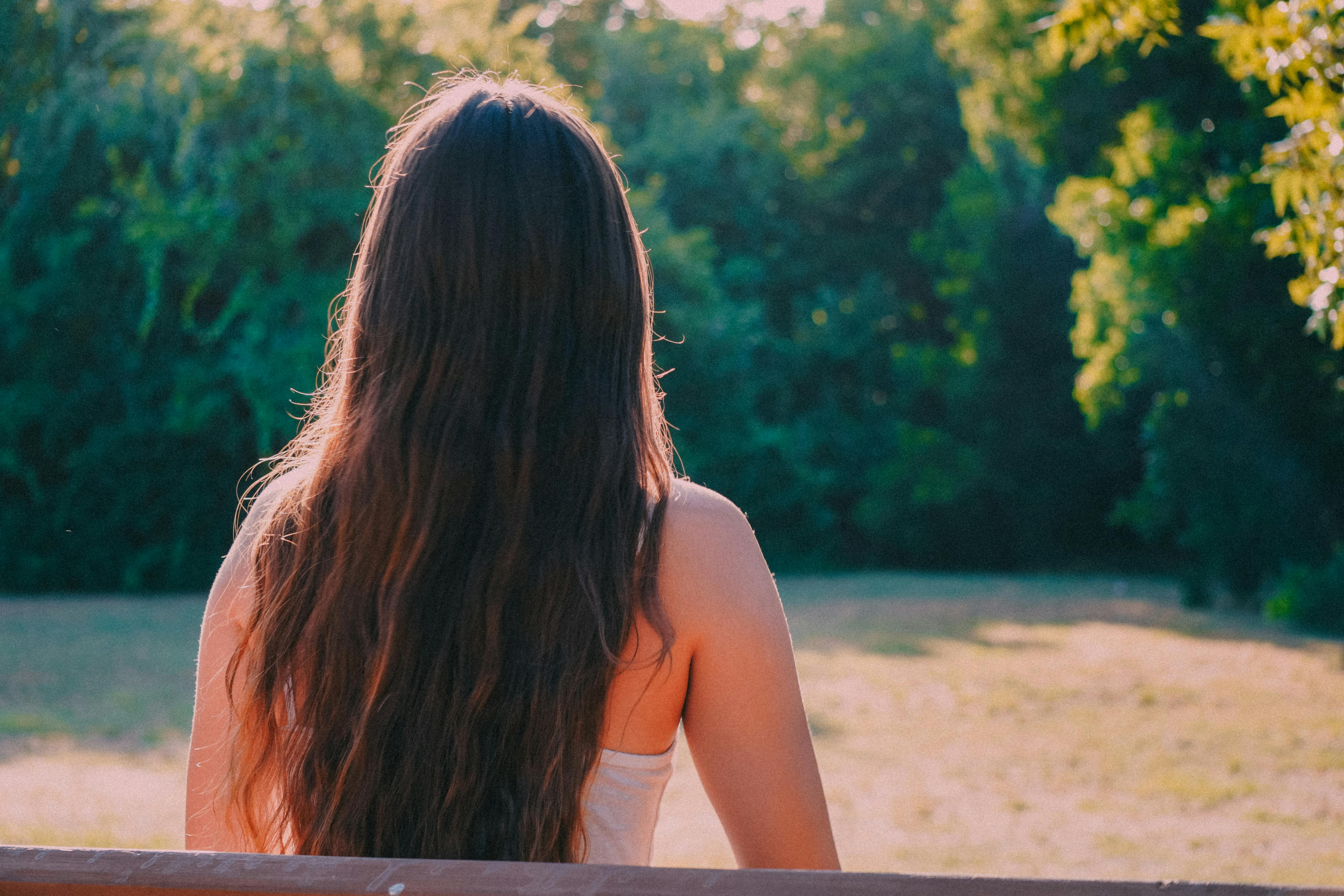 Back View of Woman on Grassland · Free Stock Photo