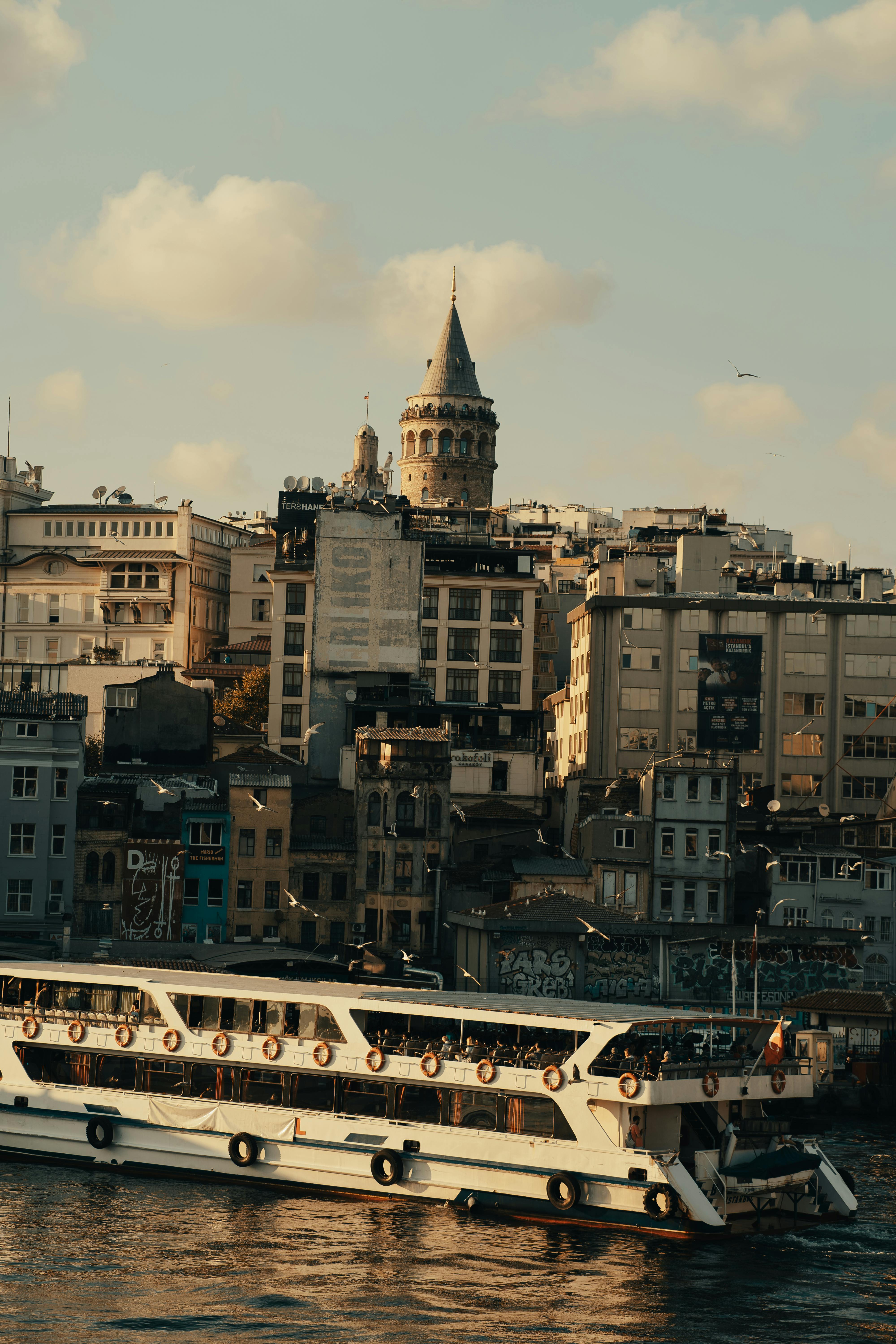 Ferry by Waterfront of Galata District in Istanbul · Free Stock Photo