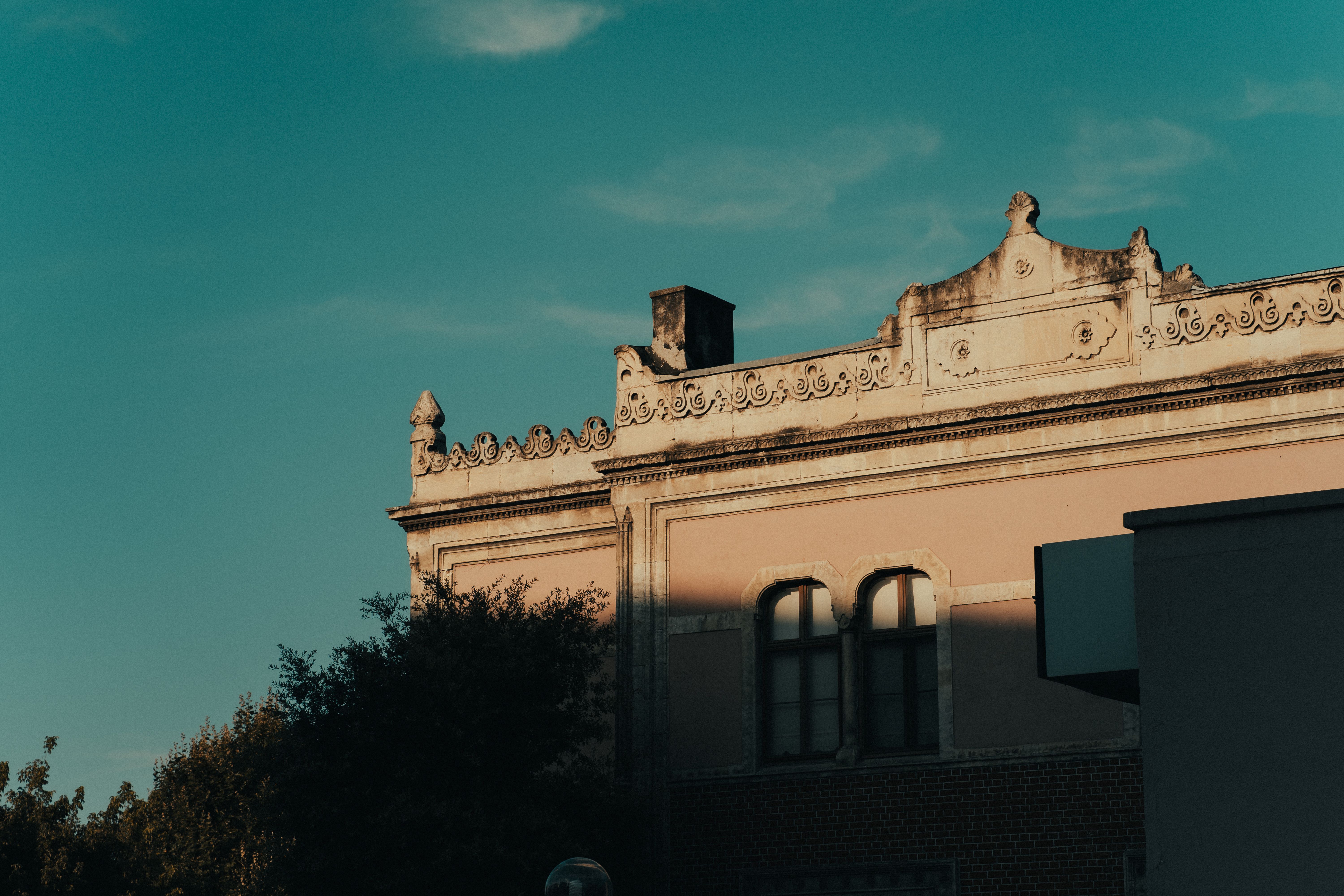 Shadow under Sunlit Building Wall · Free Stock Photo