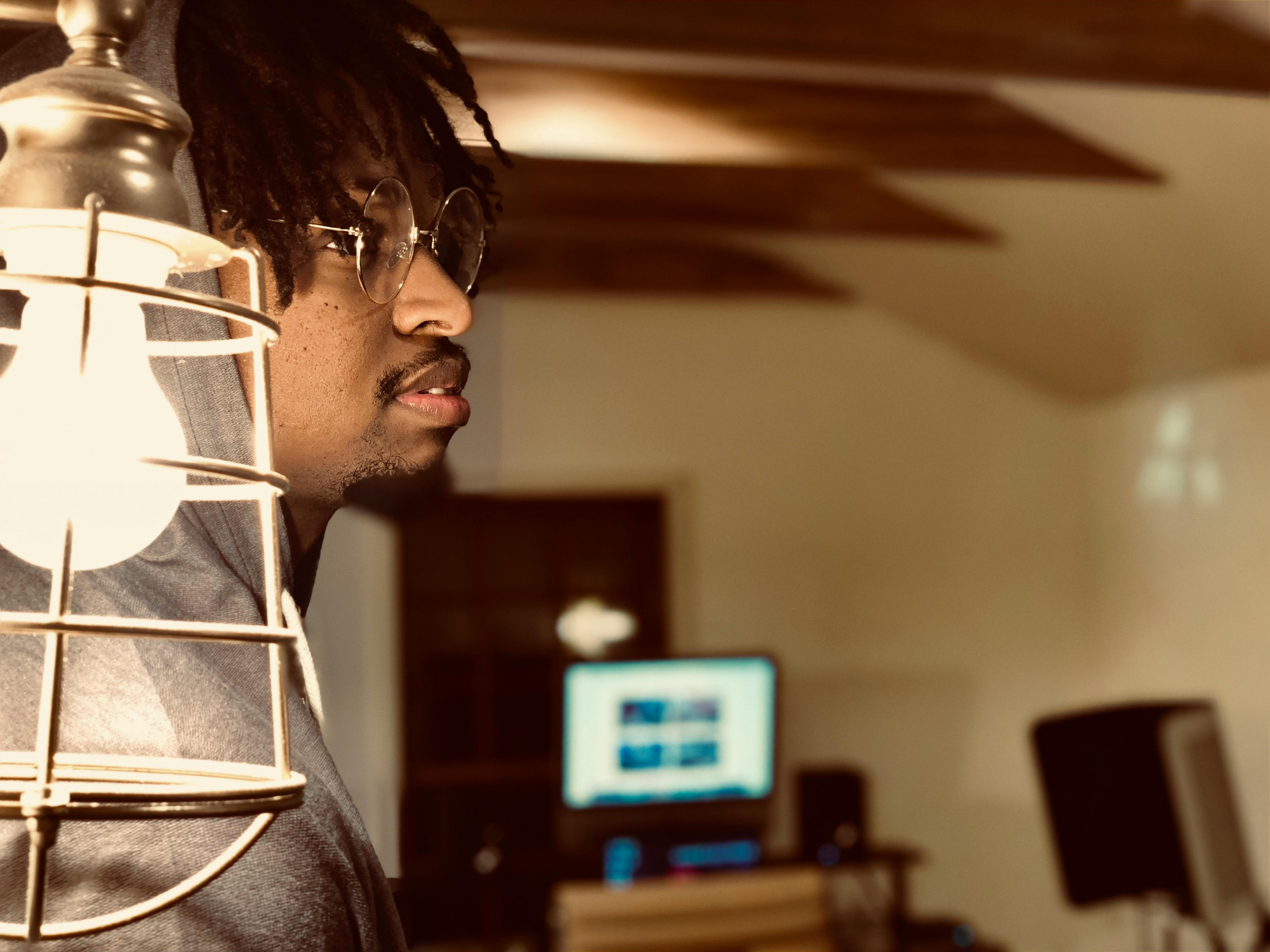 Man Standing Near Lamp · Free Stock Photo