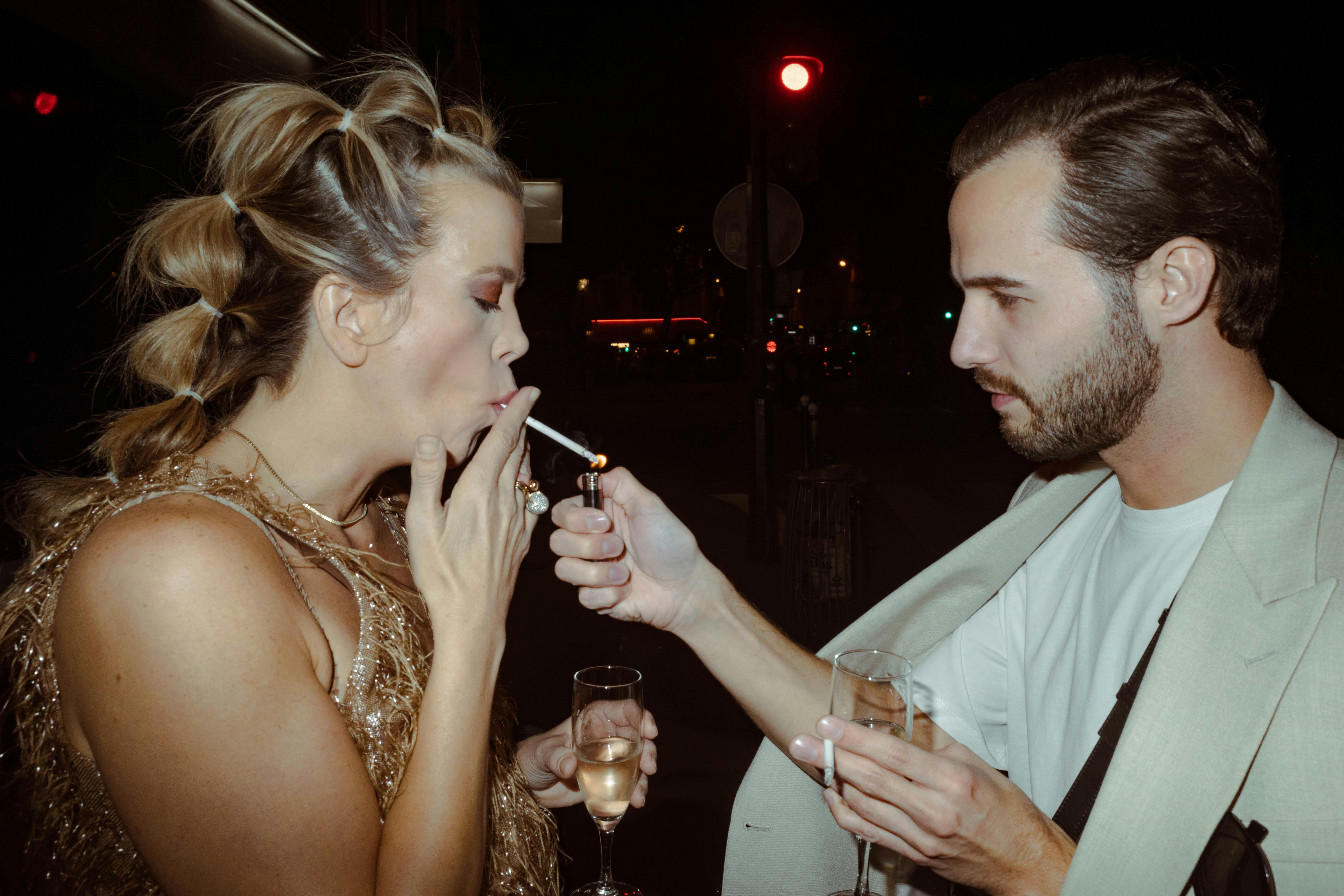 Man Lighting Woman Cigarette · Free Stock Photo