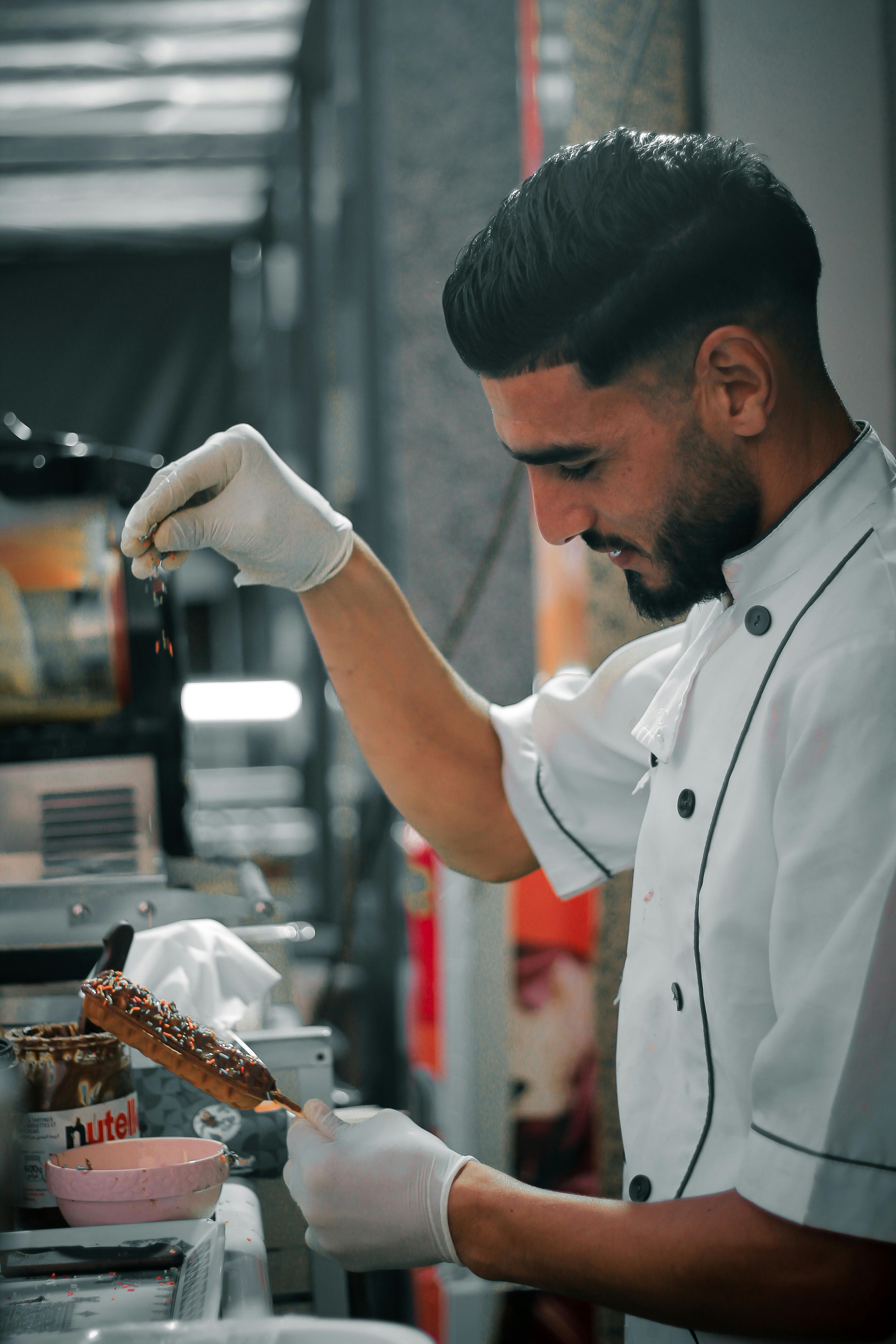 Cook Decorating a Cookie · Free Stock Photo
