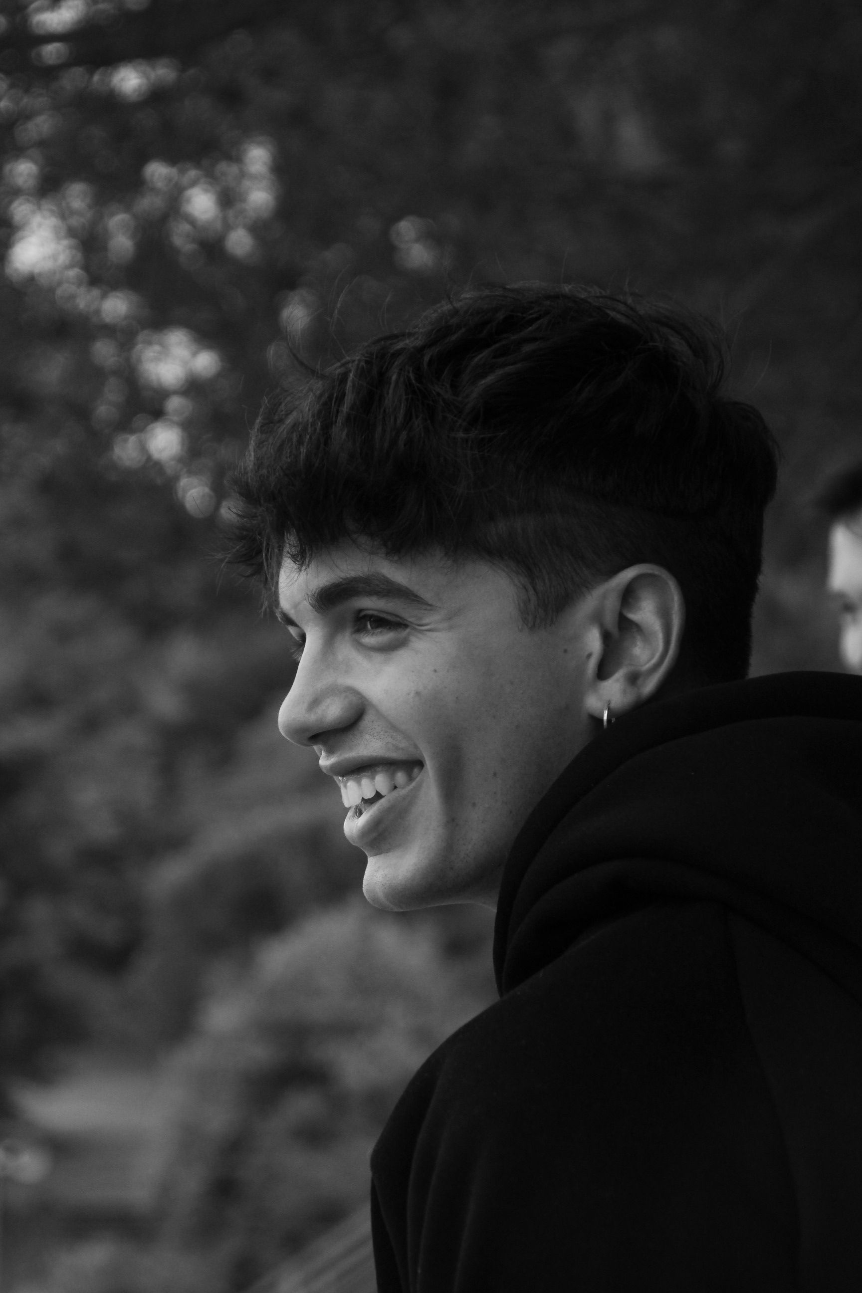 Portrait of Smiling Man seen from Profile · Free Stock Photo