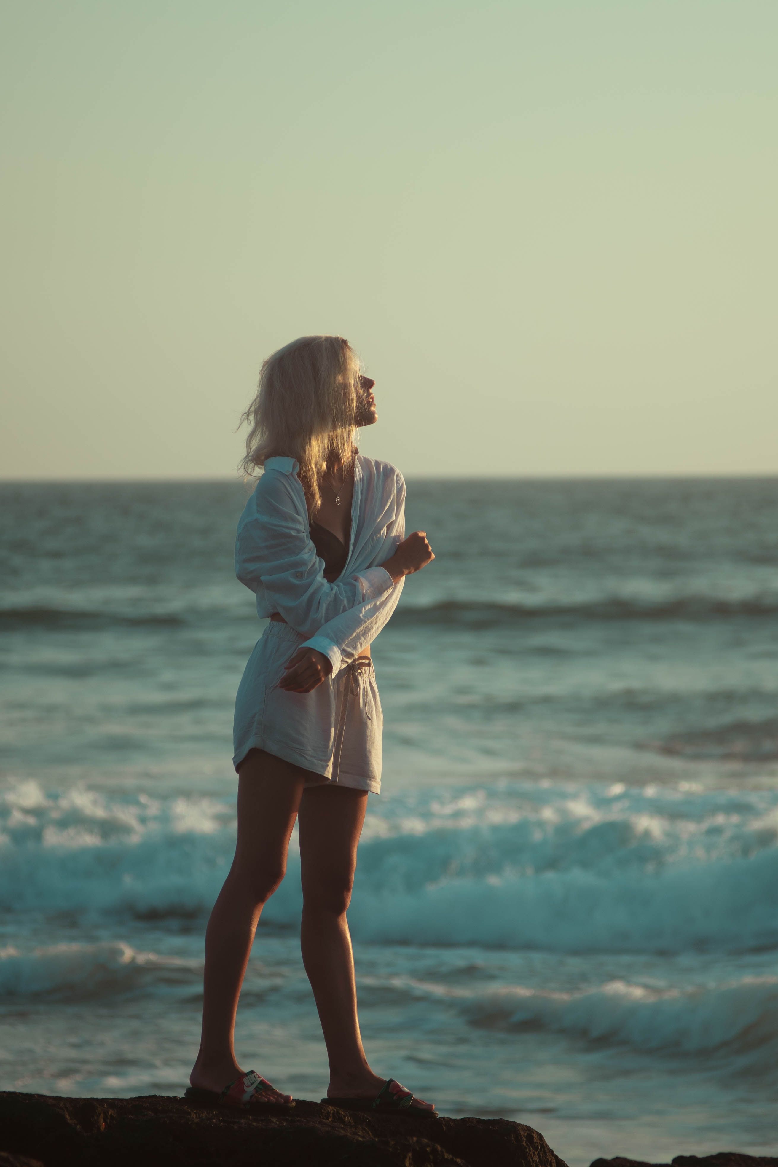 Woman Posing on Sea Shore · Free Stock Photo