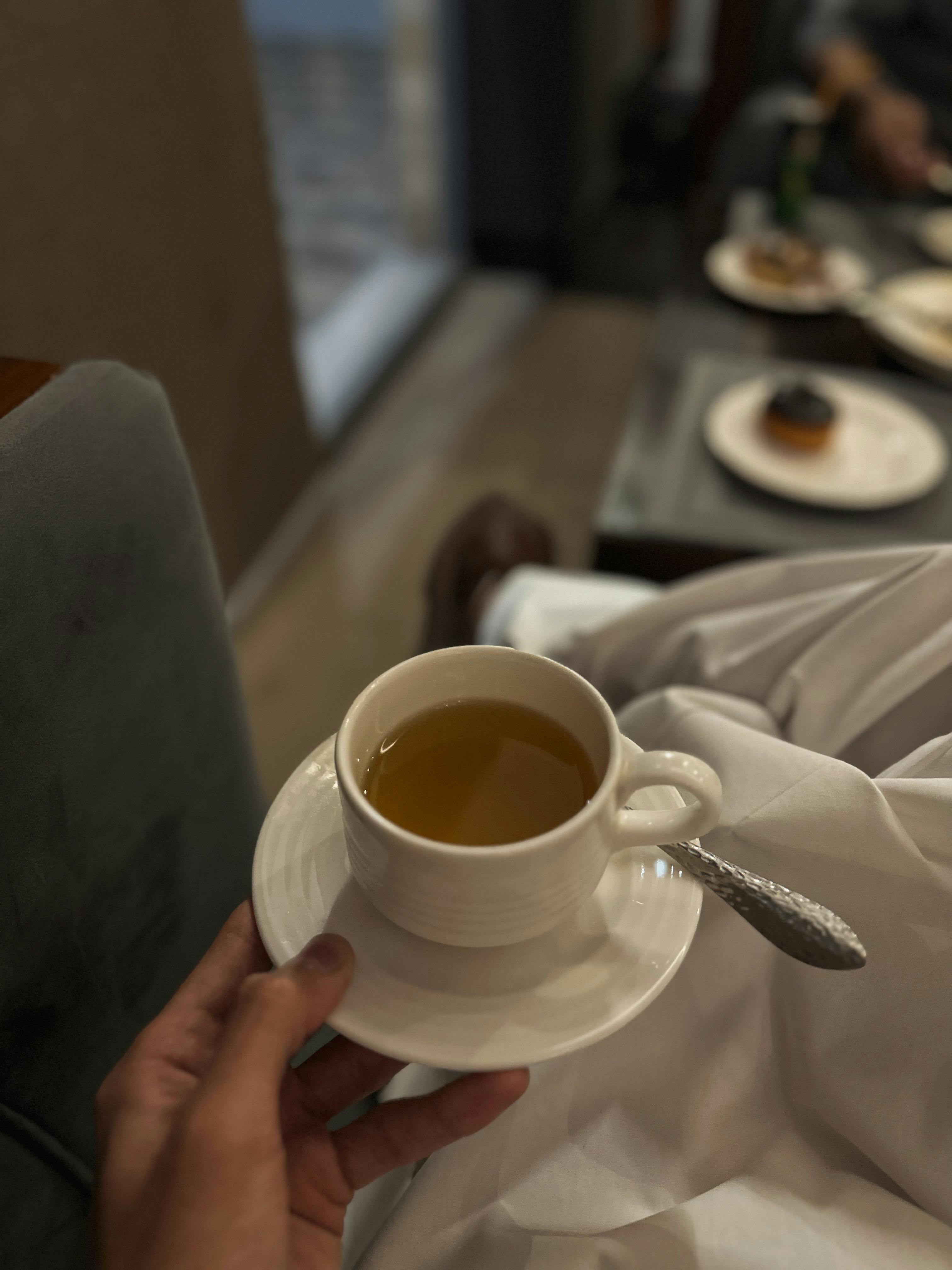 A Person Holding a Cup of Tea · Free Stock Photo
