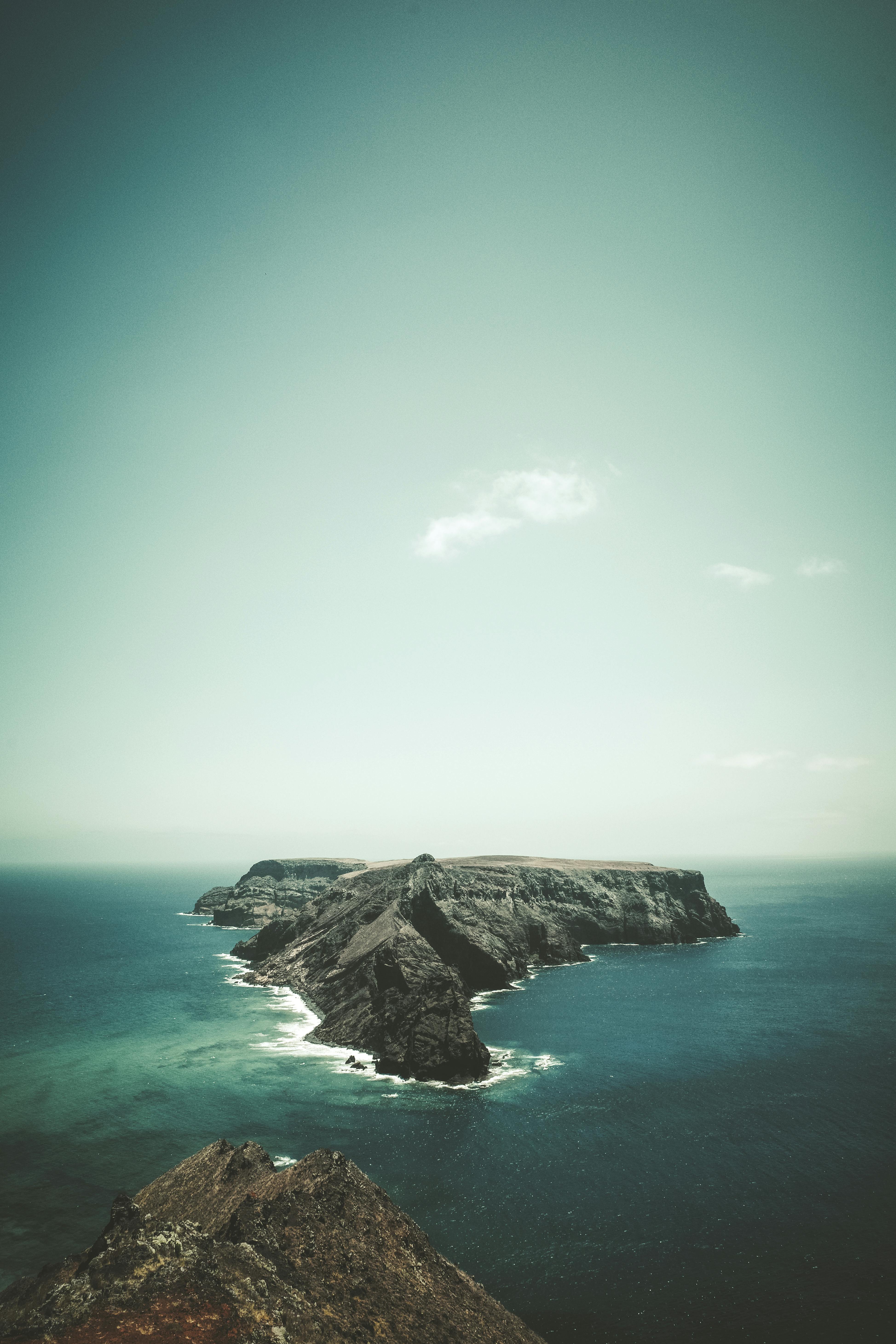 Aerial View of Small Rocky Islet in Ocean · Free Stock Photo
