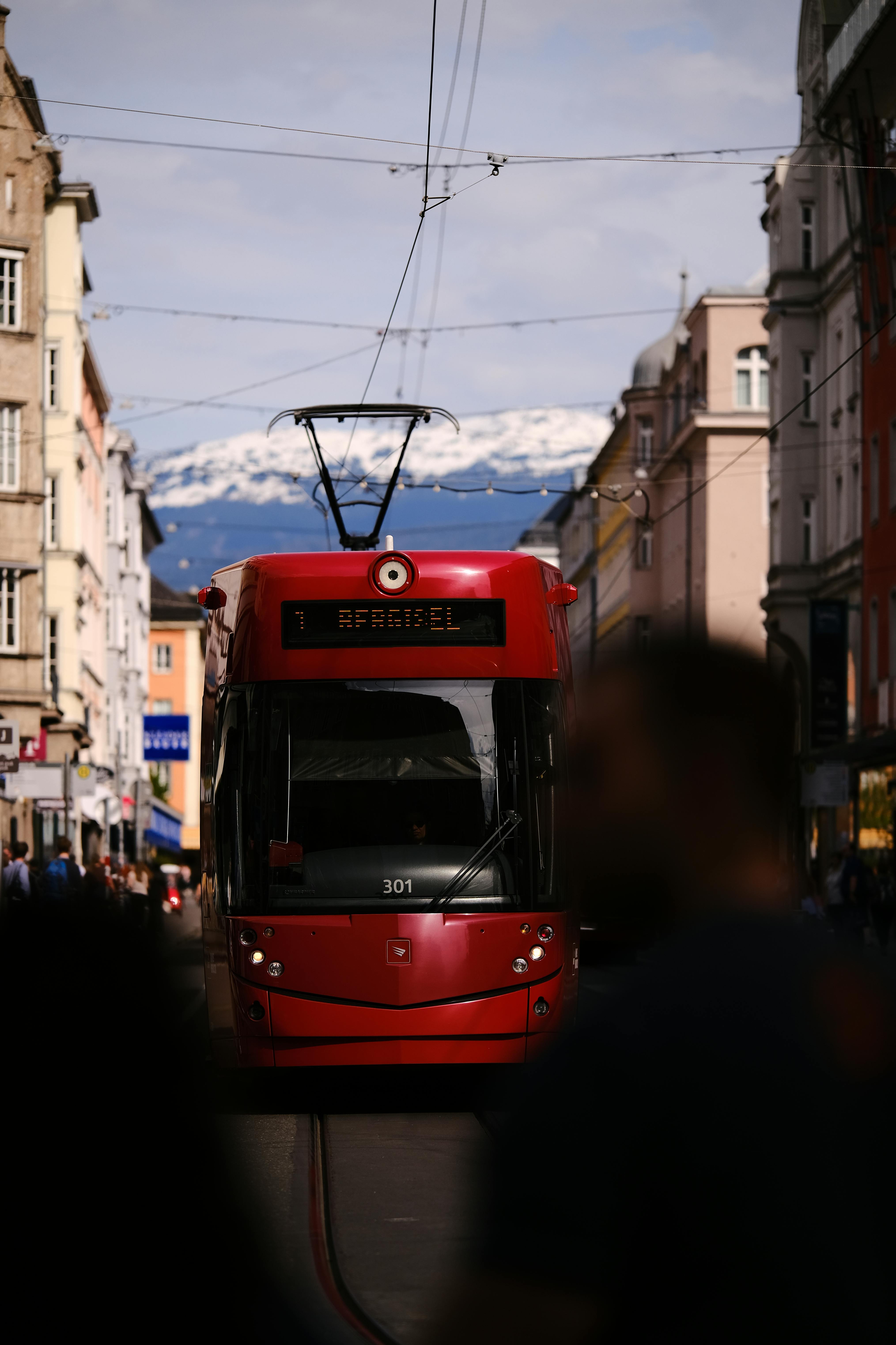 View of a Red Tram on a Street in Innsbruck, Austria · Free Stock Photo