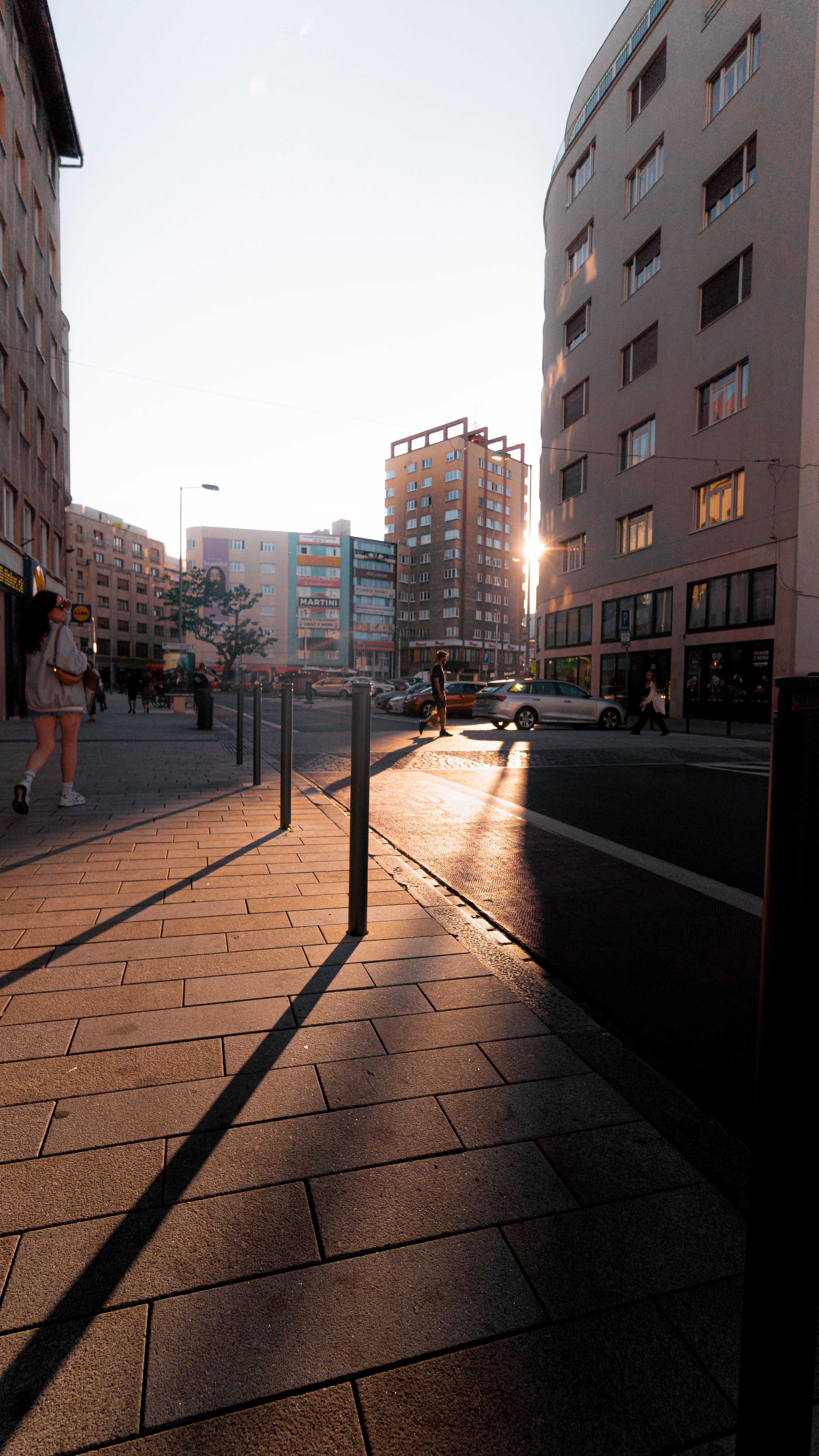 The Sun Shining between the Buildings in City · Free Stock Photo