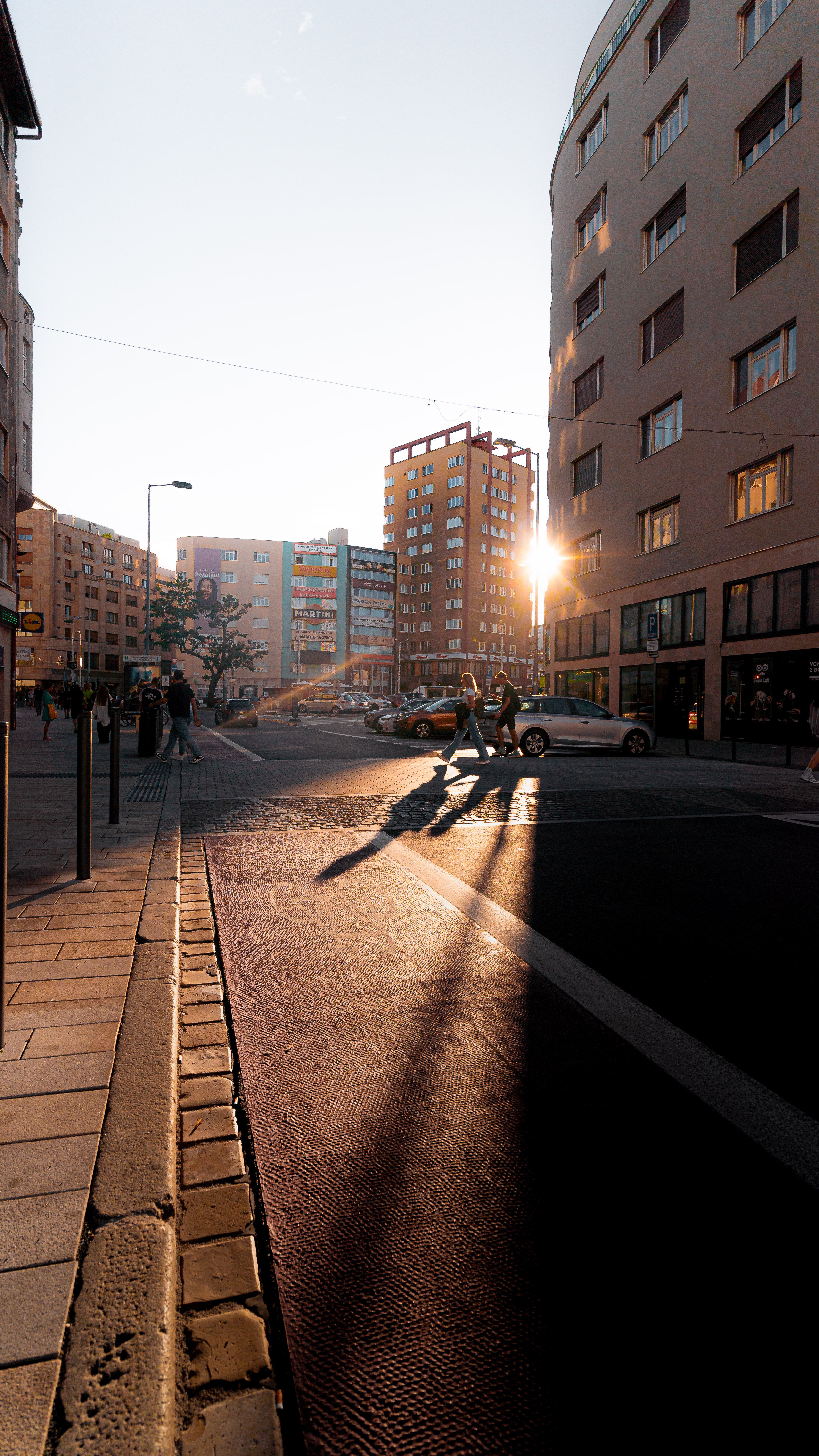 The Sun Shining between the Buildings in City · Free Stock Photo