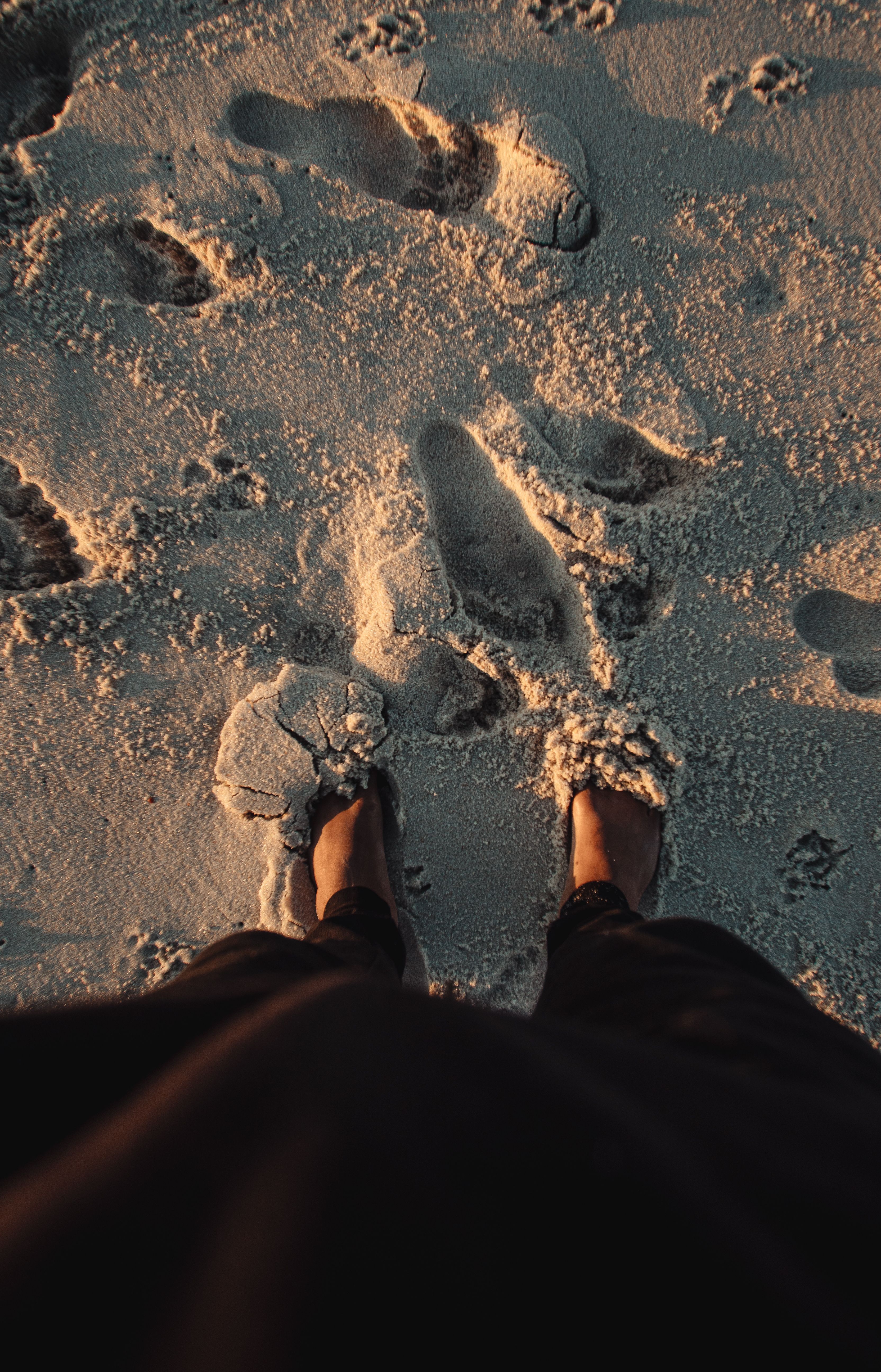Man Standing on Sand Beach on Sunset · Free Stock Photo