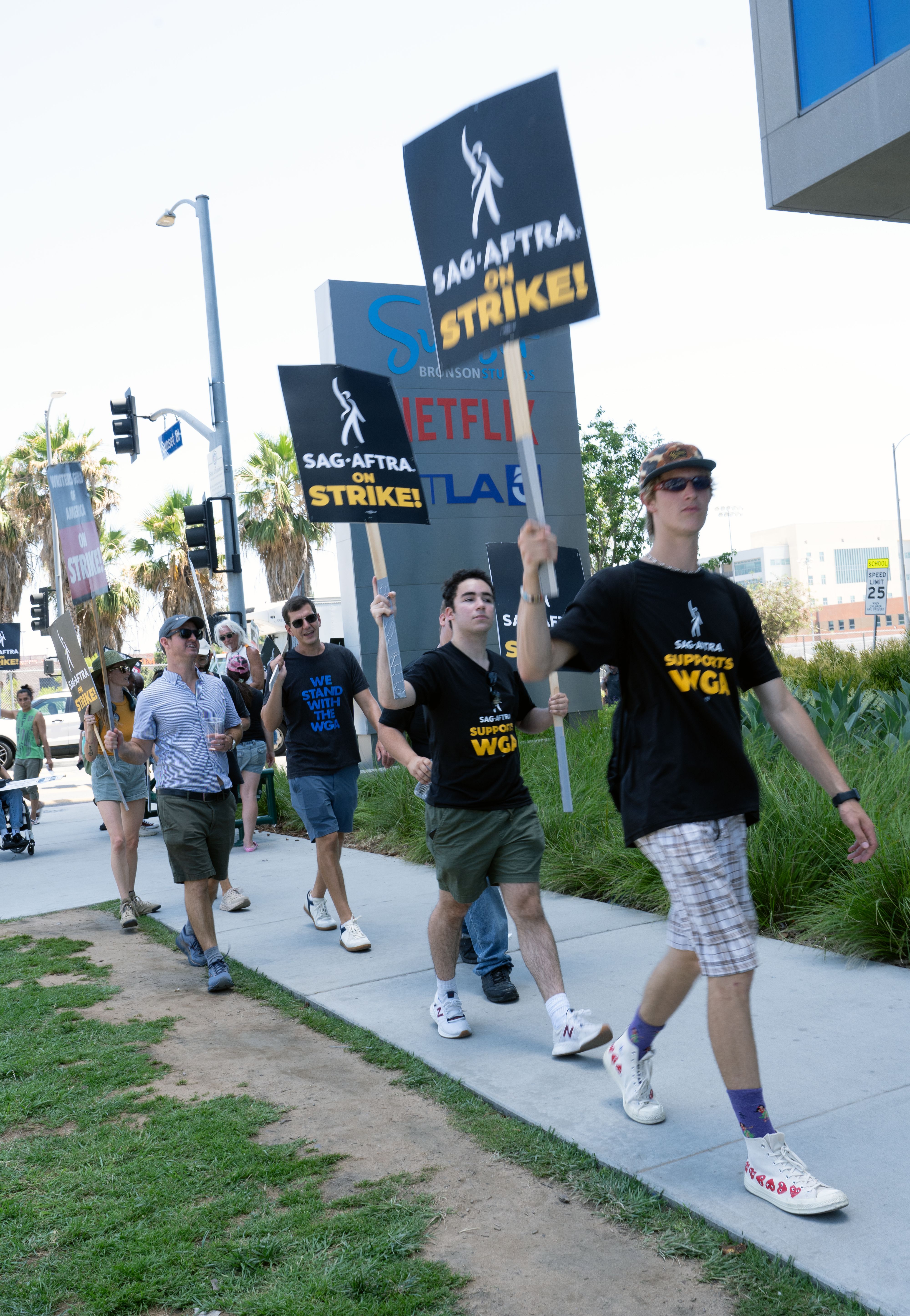 Group Walking with Signs on Strike · Free Stock Photo
