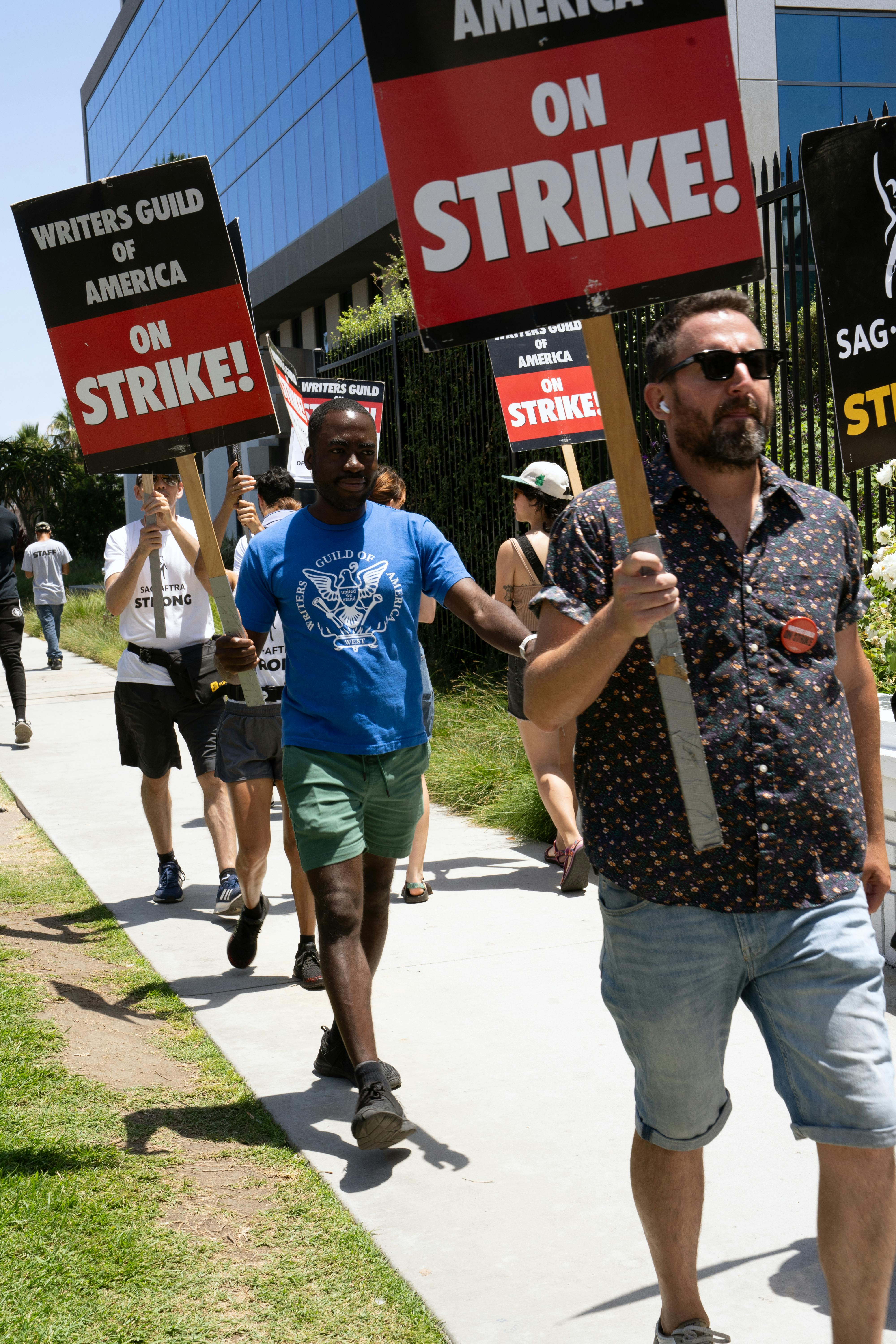 Men Walking with Banners · Free Stock Photo