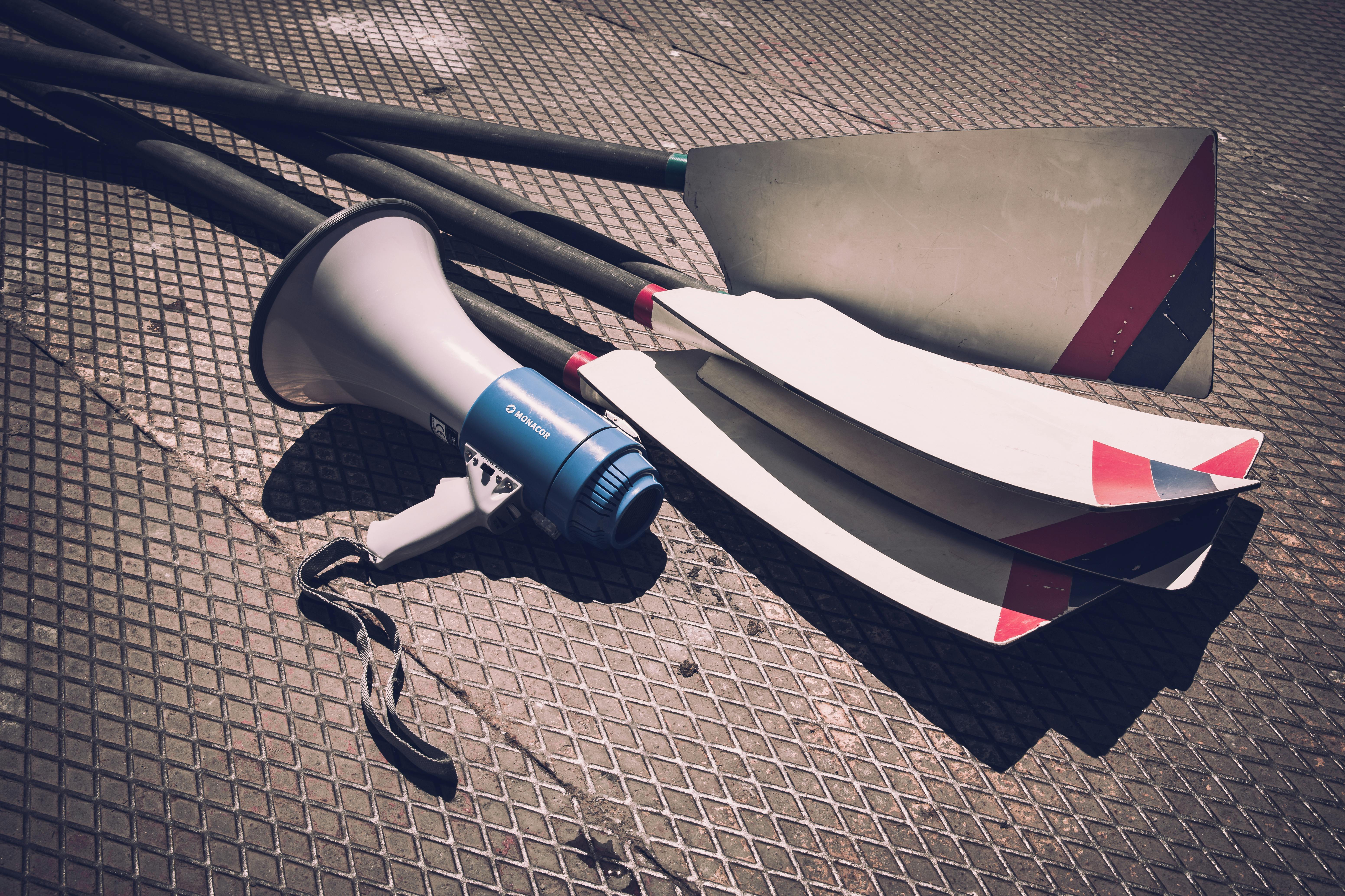 Megaphone and Oars on Ground · Free Stock Photo