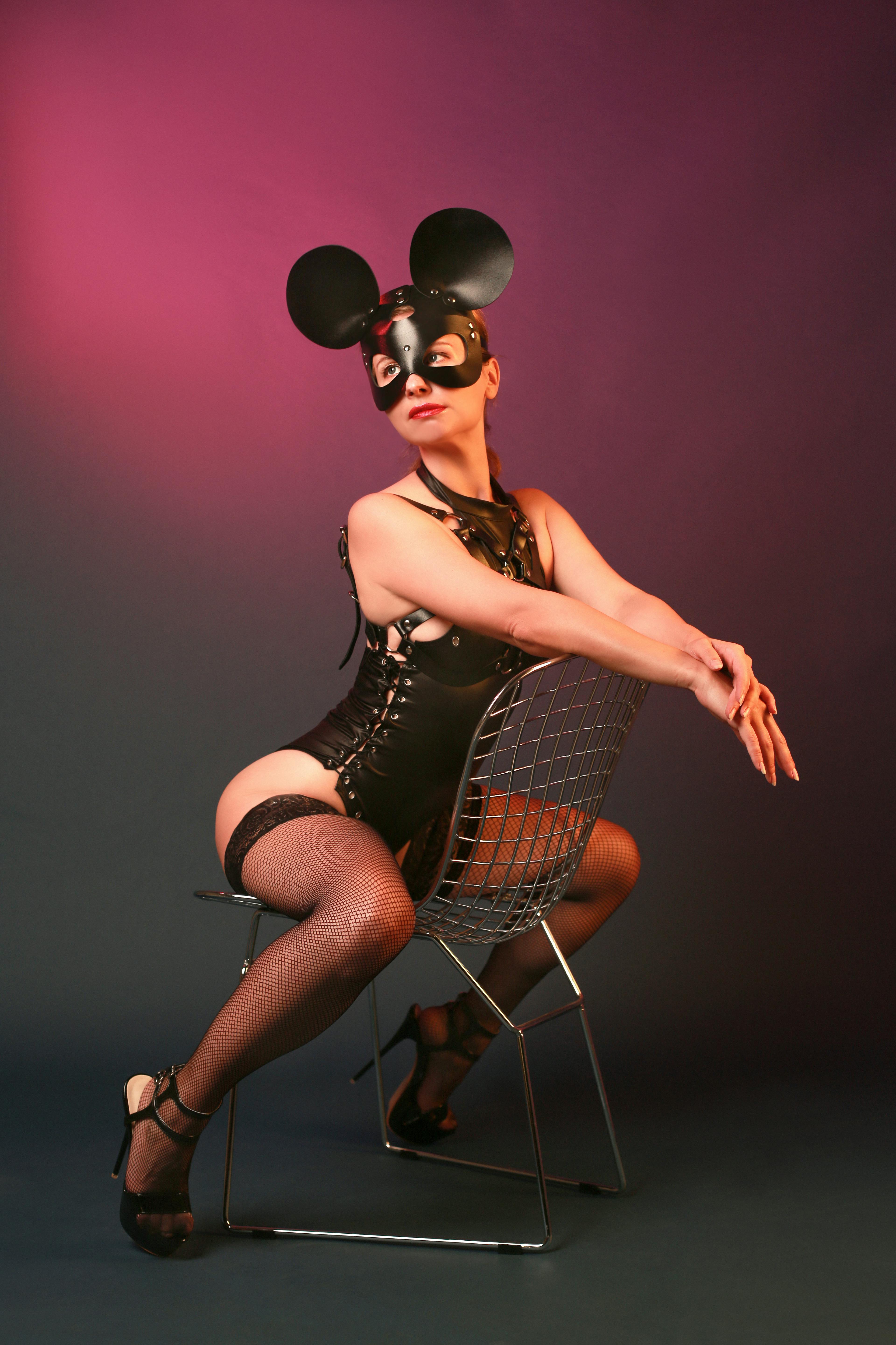 Woman in Mouse Costume Posing on a Chair · Free Stock Photo