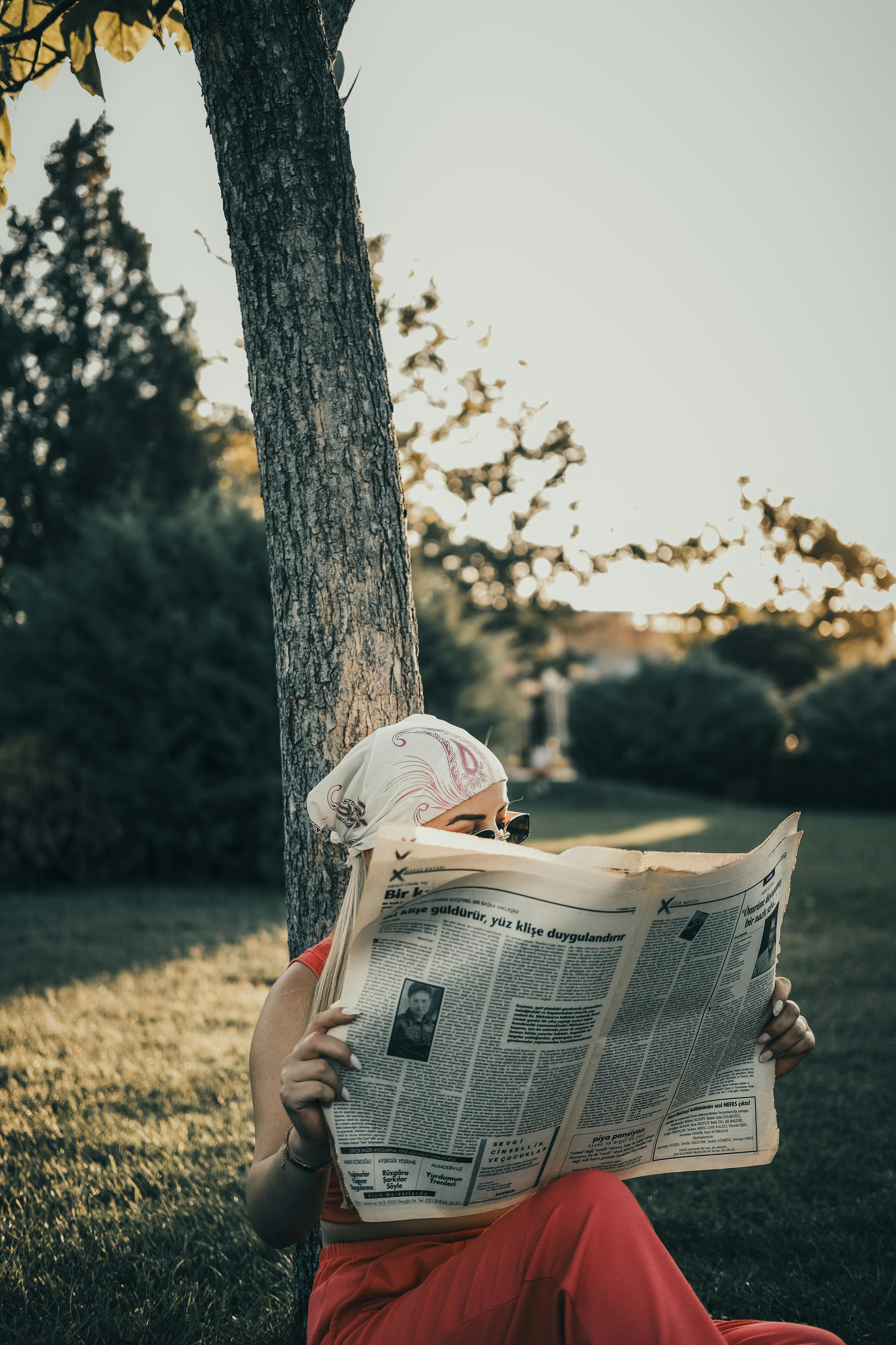Woman Reading a Newspaper · Free Stock Photo