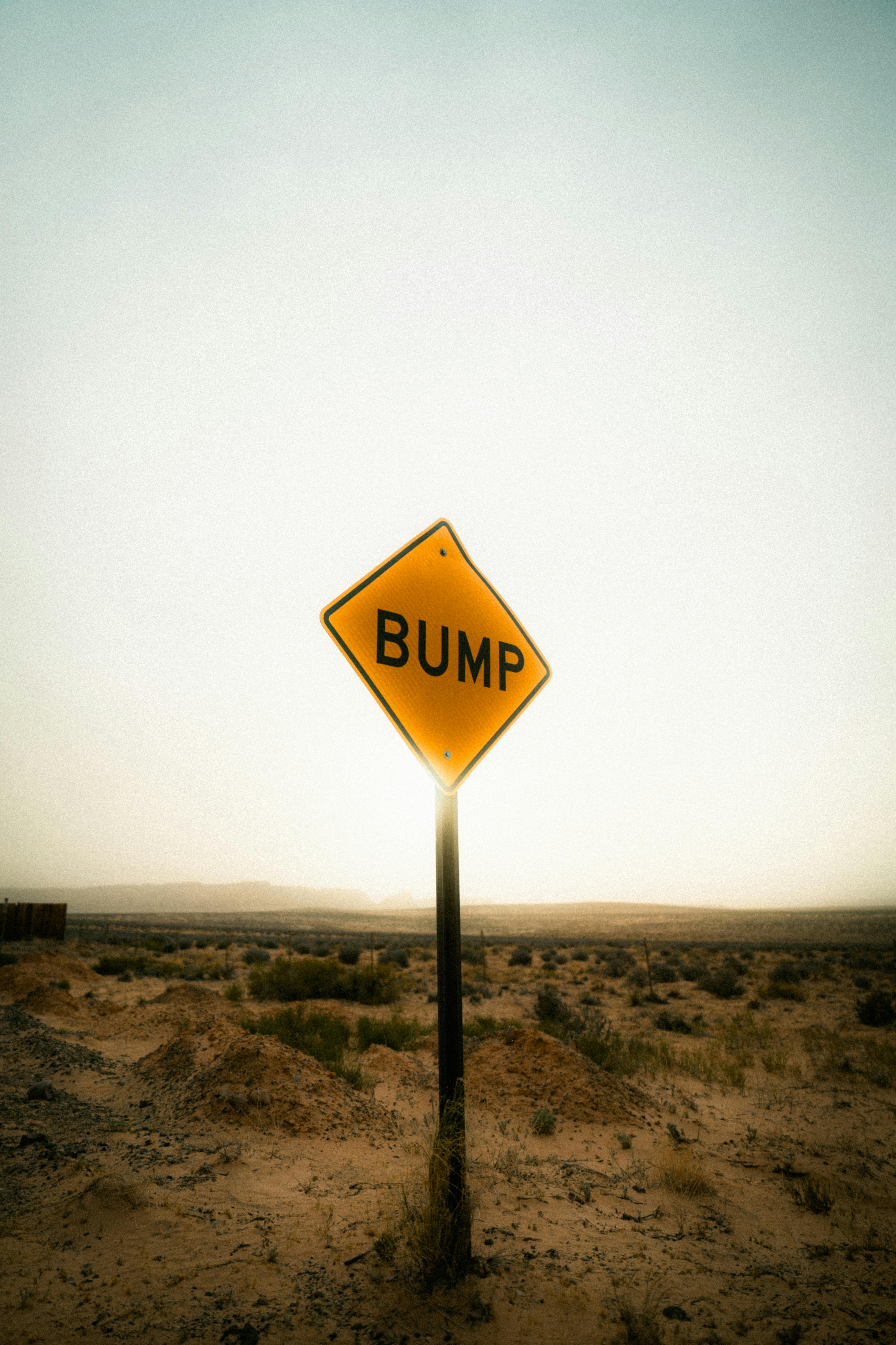 Sunset Sunlight over Road Sign on Prairie · Free Stock Photo