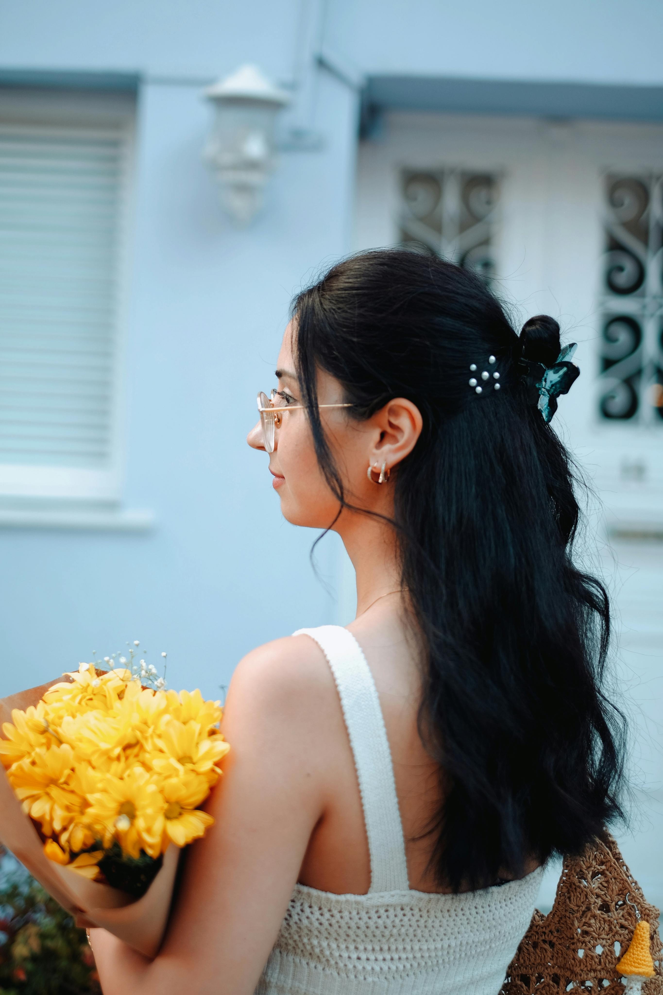 Brunette Woman with Yellow Flowers · Free Stock Photo