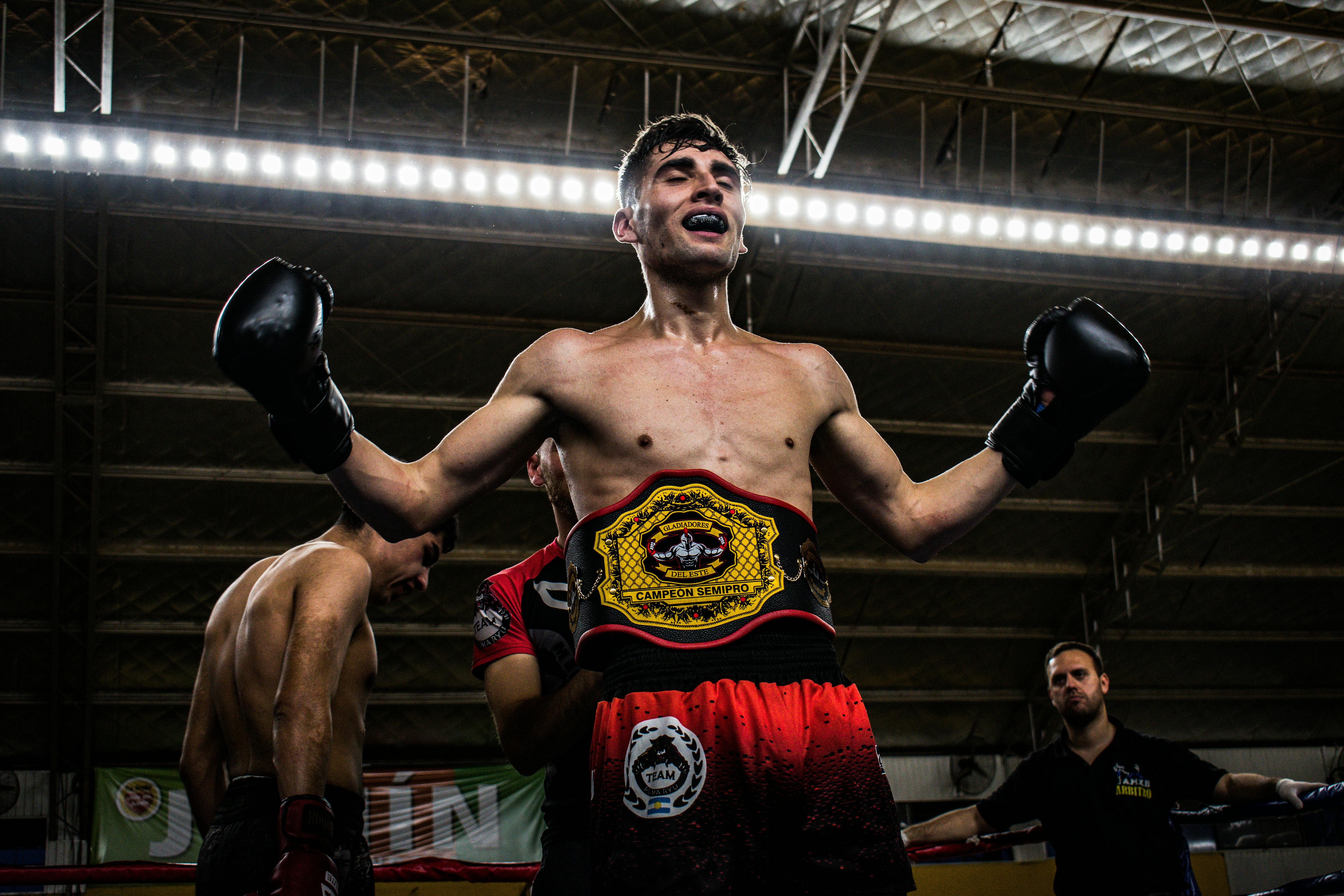 Winner of the Fight Receiving the Championship Belt · Free Stock Photo
