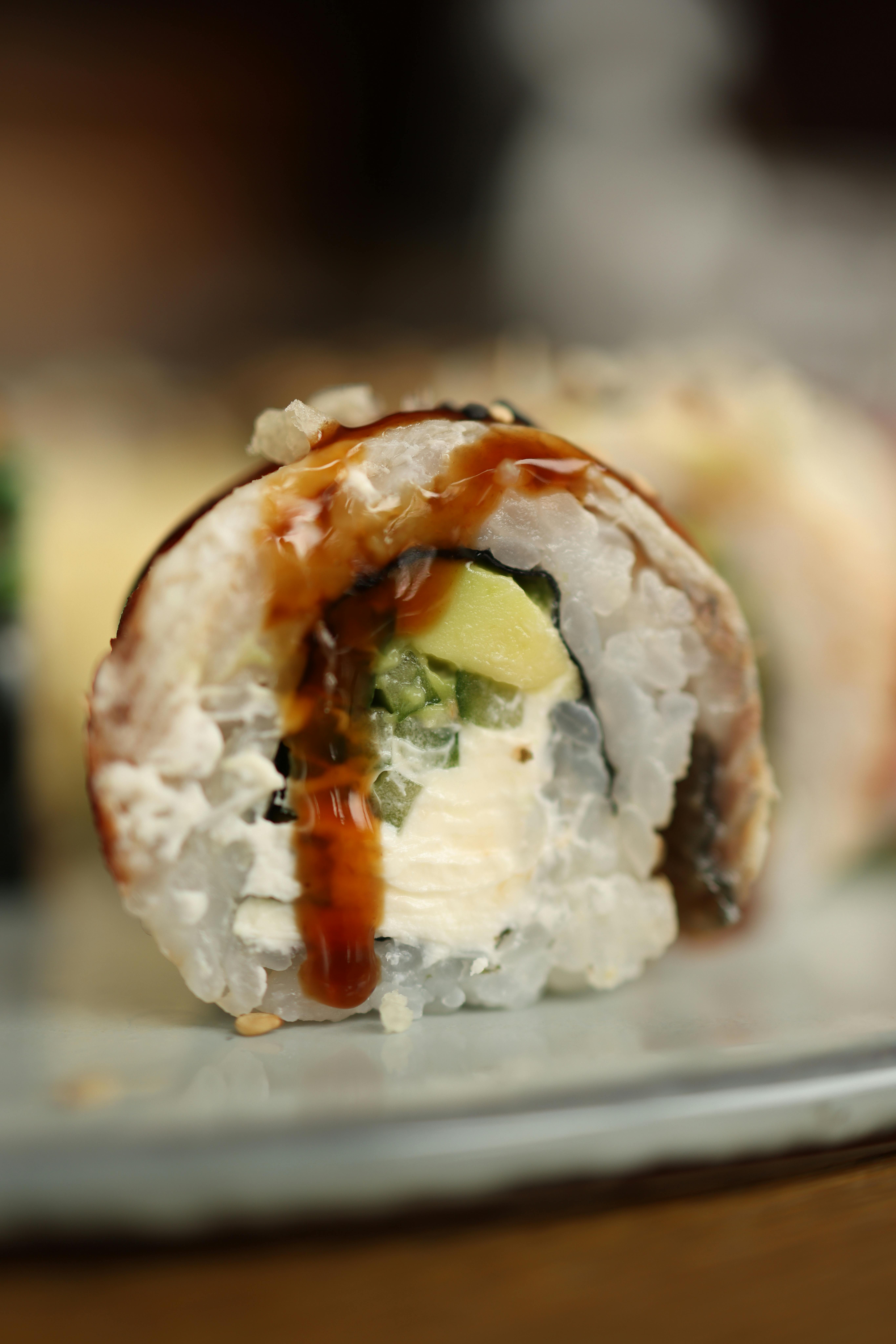 A Chef Using a Blow Torch on Sushi Rolls · Free Stock Photo