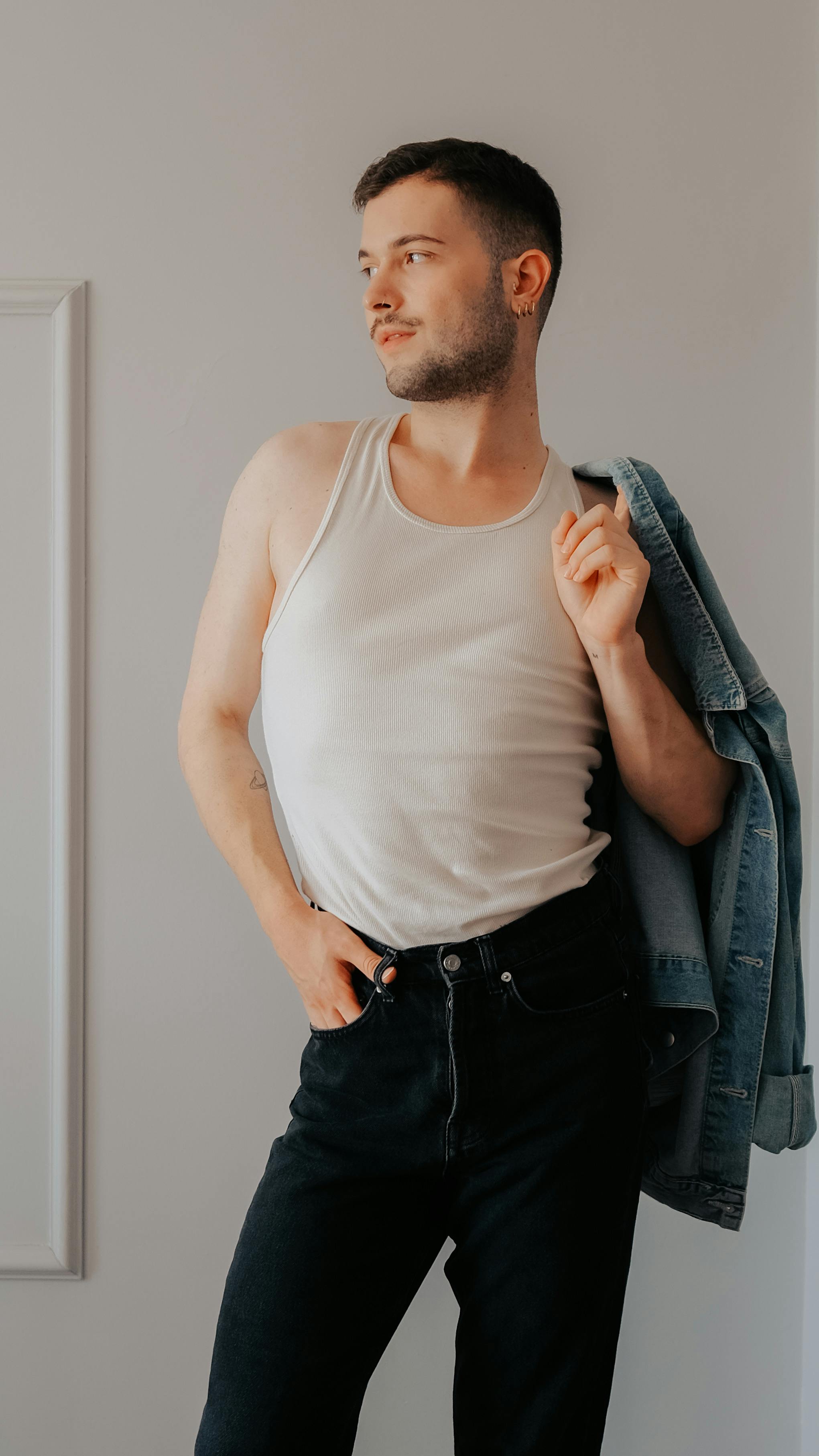 Man Posing in Denim Jacket · Free Stock Photo