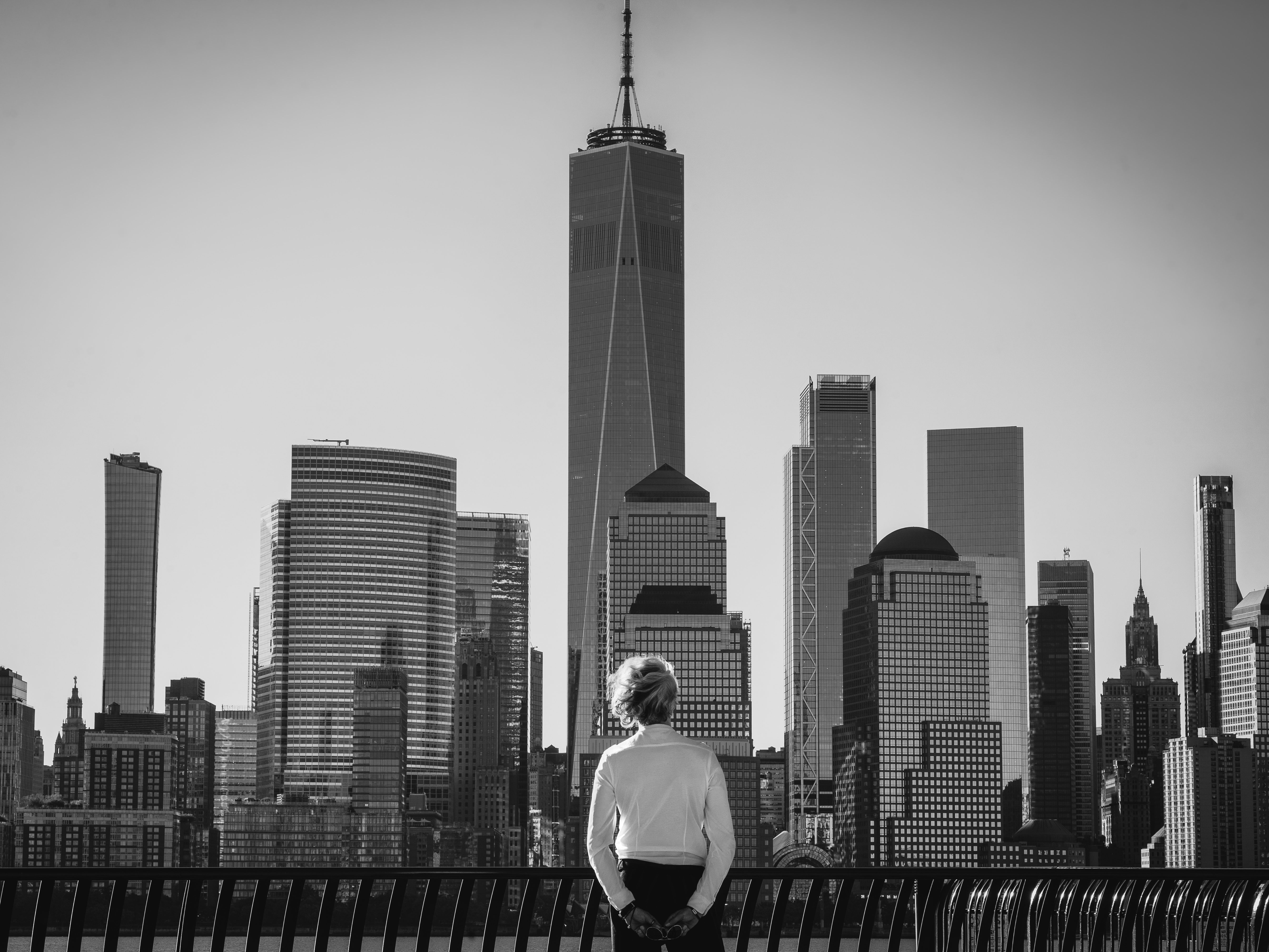 Woman in Shirt Standing with Manhattan Buildings behind · Free Stock Photo
