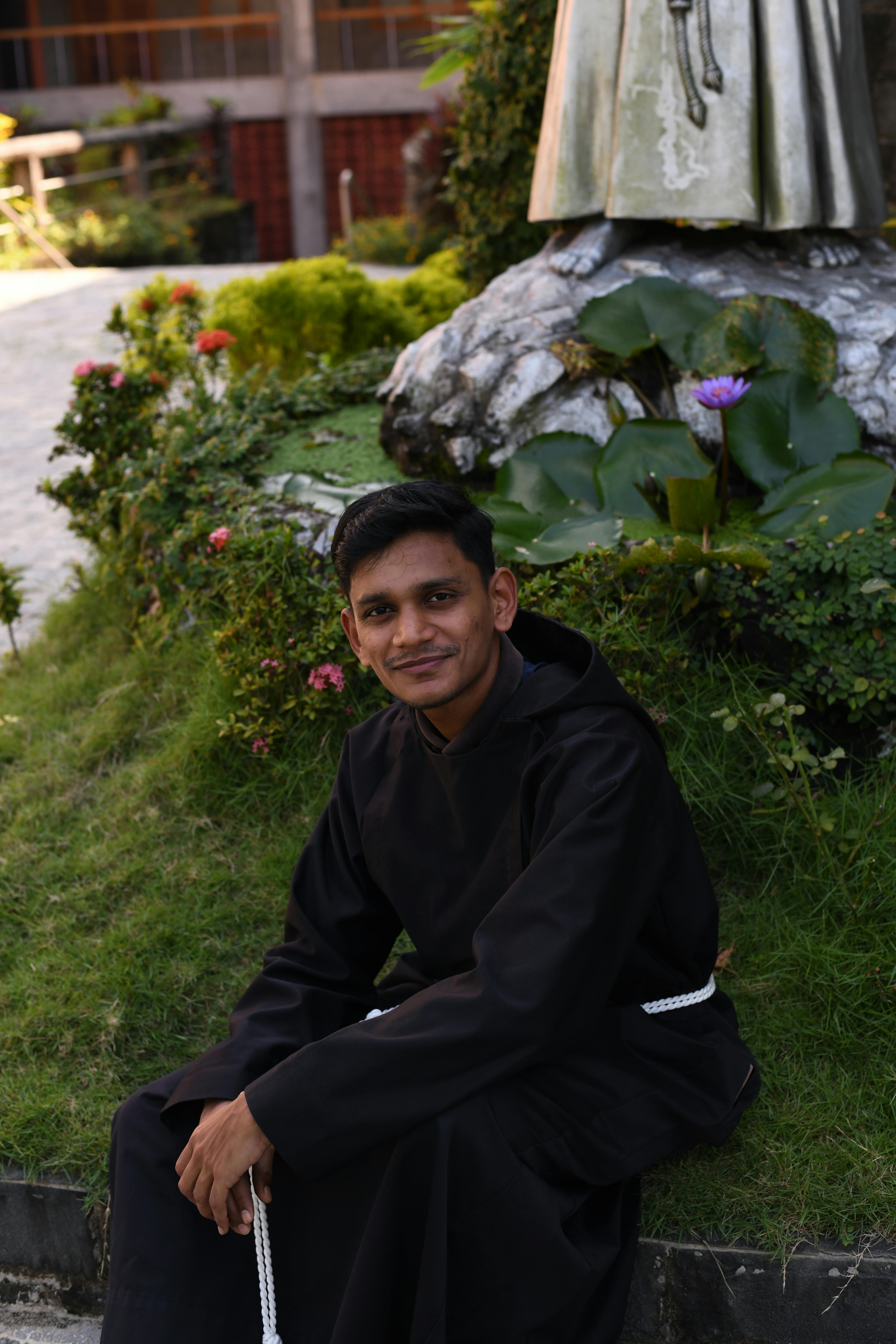 Man in Black Clothes Sitting on Grass · Free Stock Photo