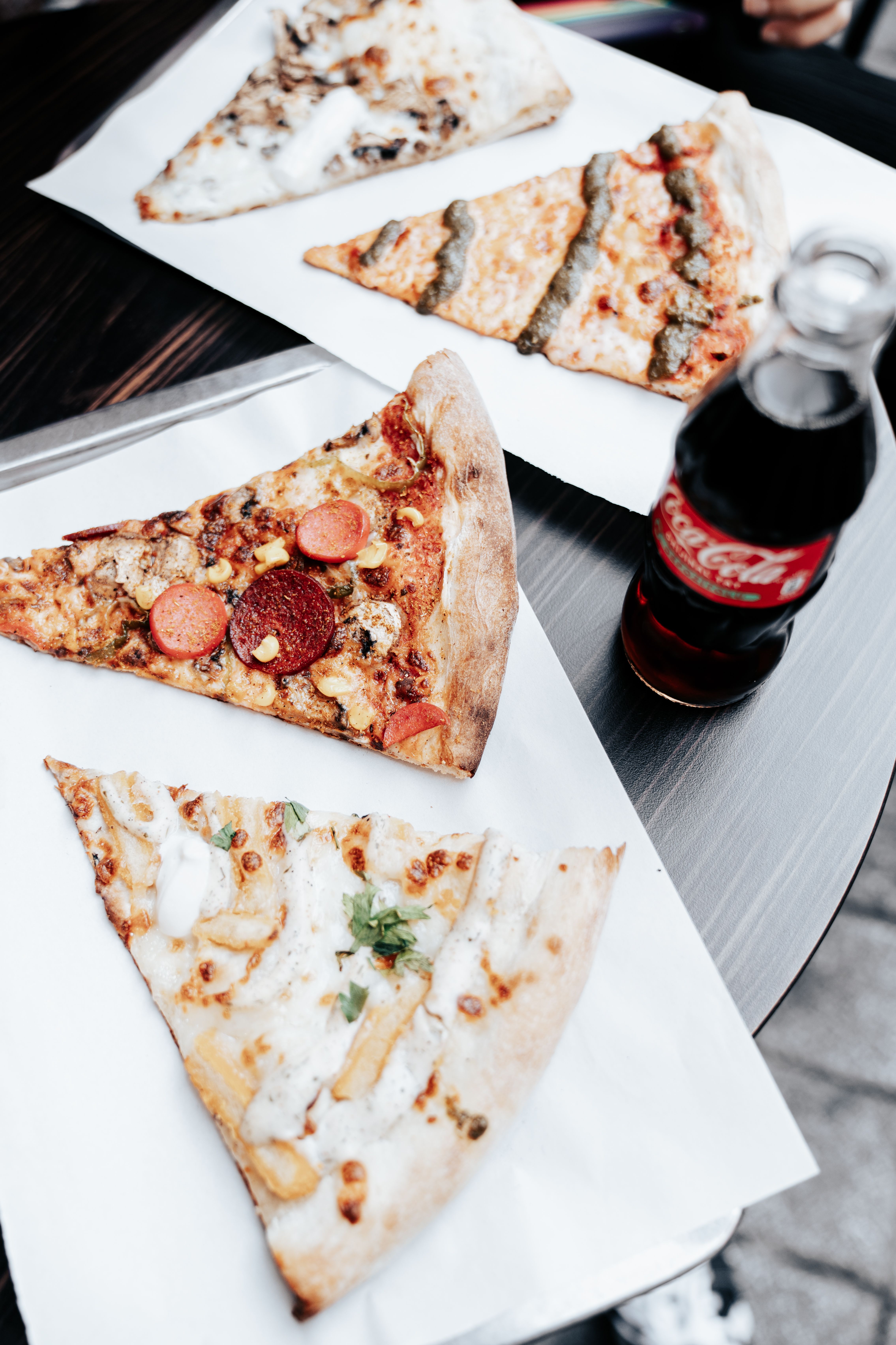 Slices of Pizza and a Bottle of Coca-Cola · Free Stock Photo