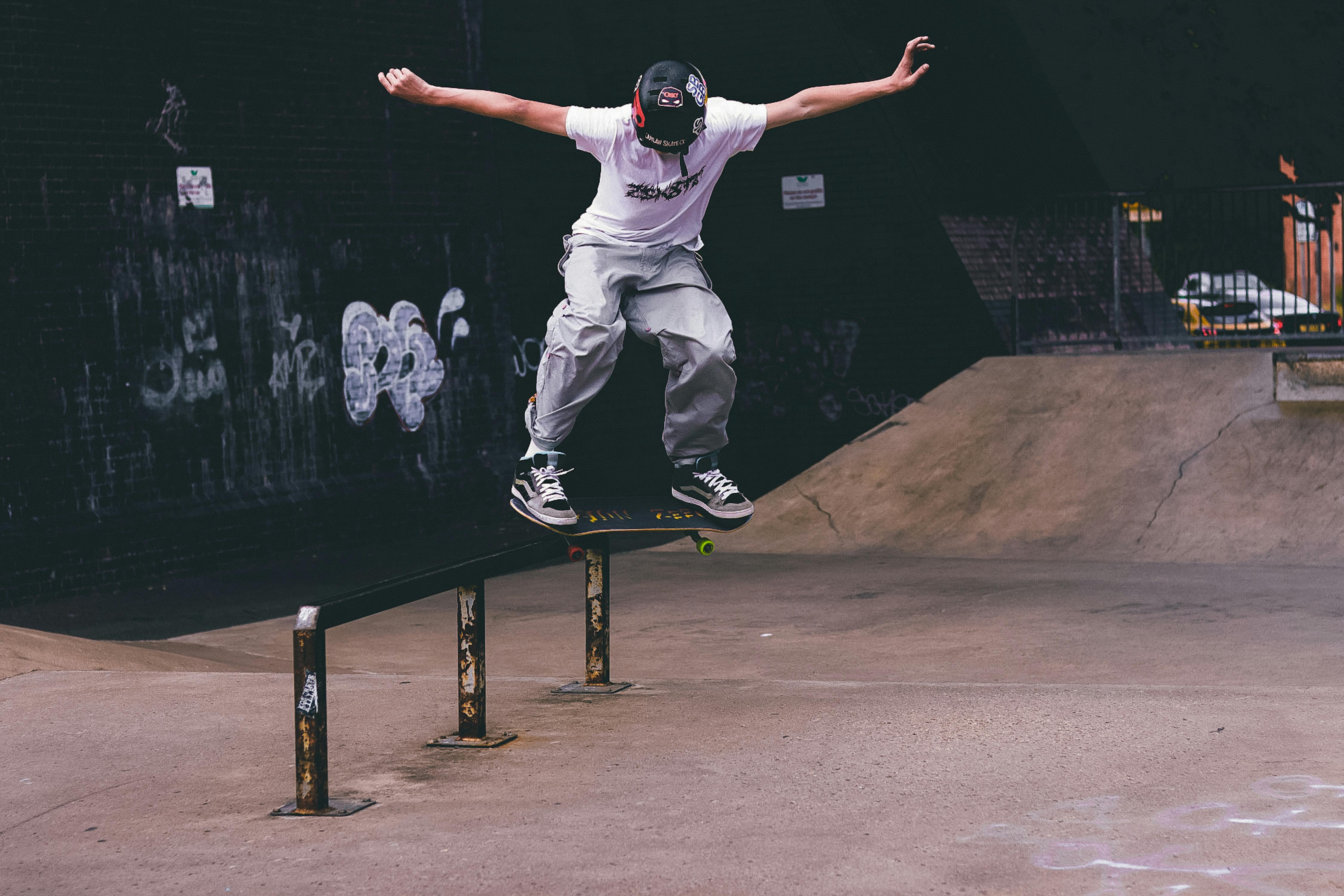 Person Standing on Skateboard Grayscale Photography · Free Stock Photo
