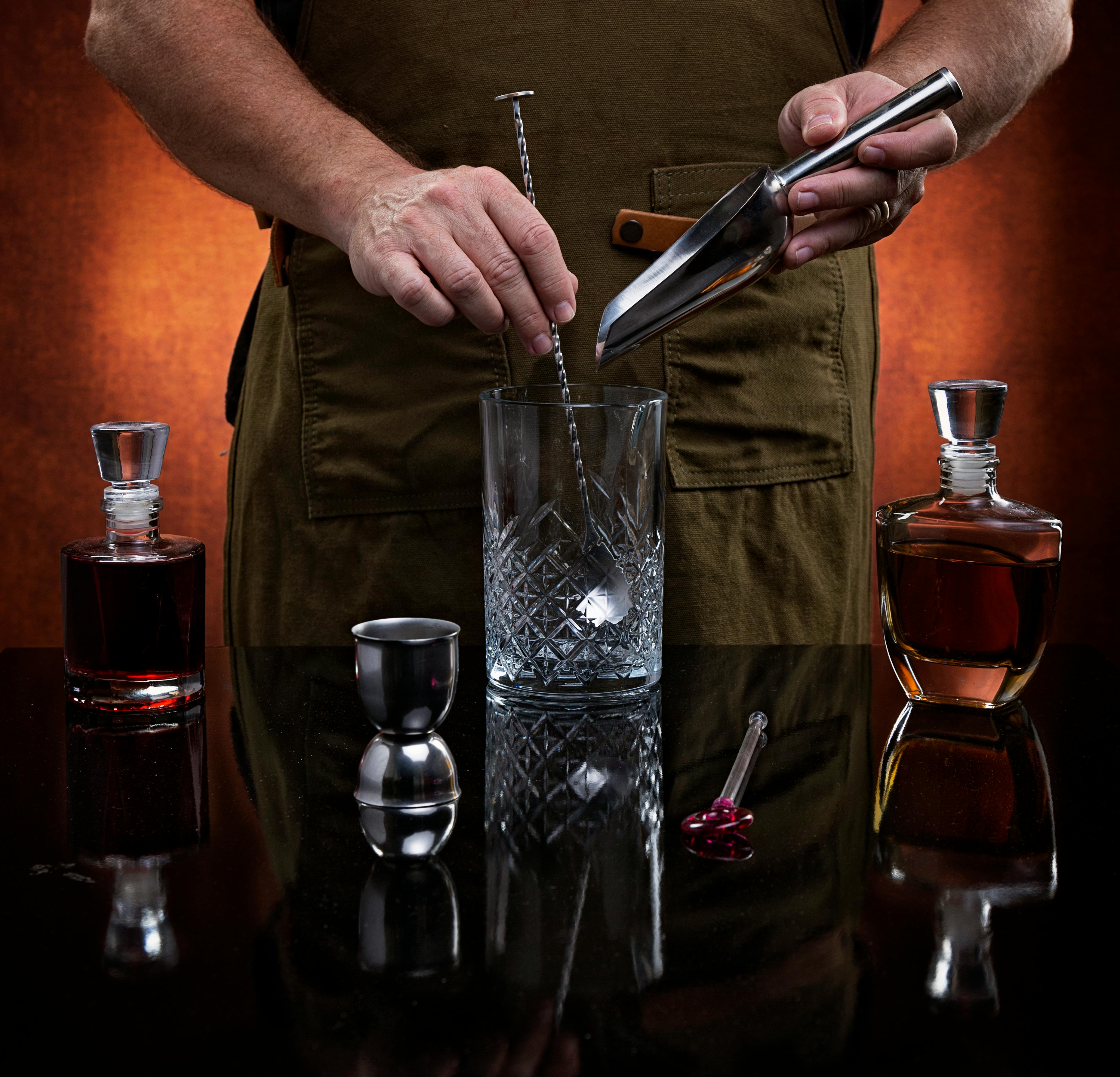 Barman Hands over Glass · Free Stock Photo