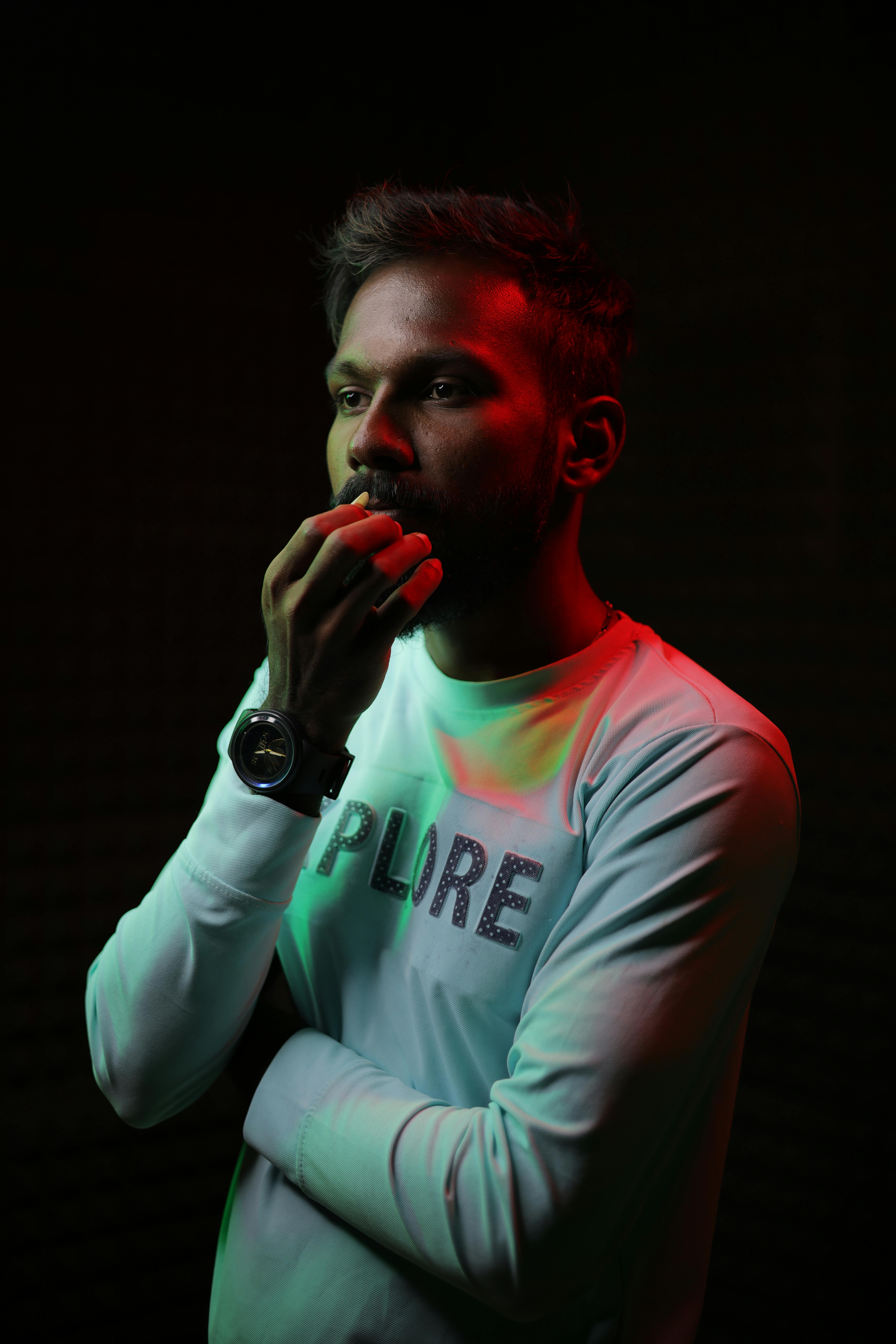 Man Standing in Long Sleeve T-Shirt Fixing Mustache · Free Stock Photo