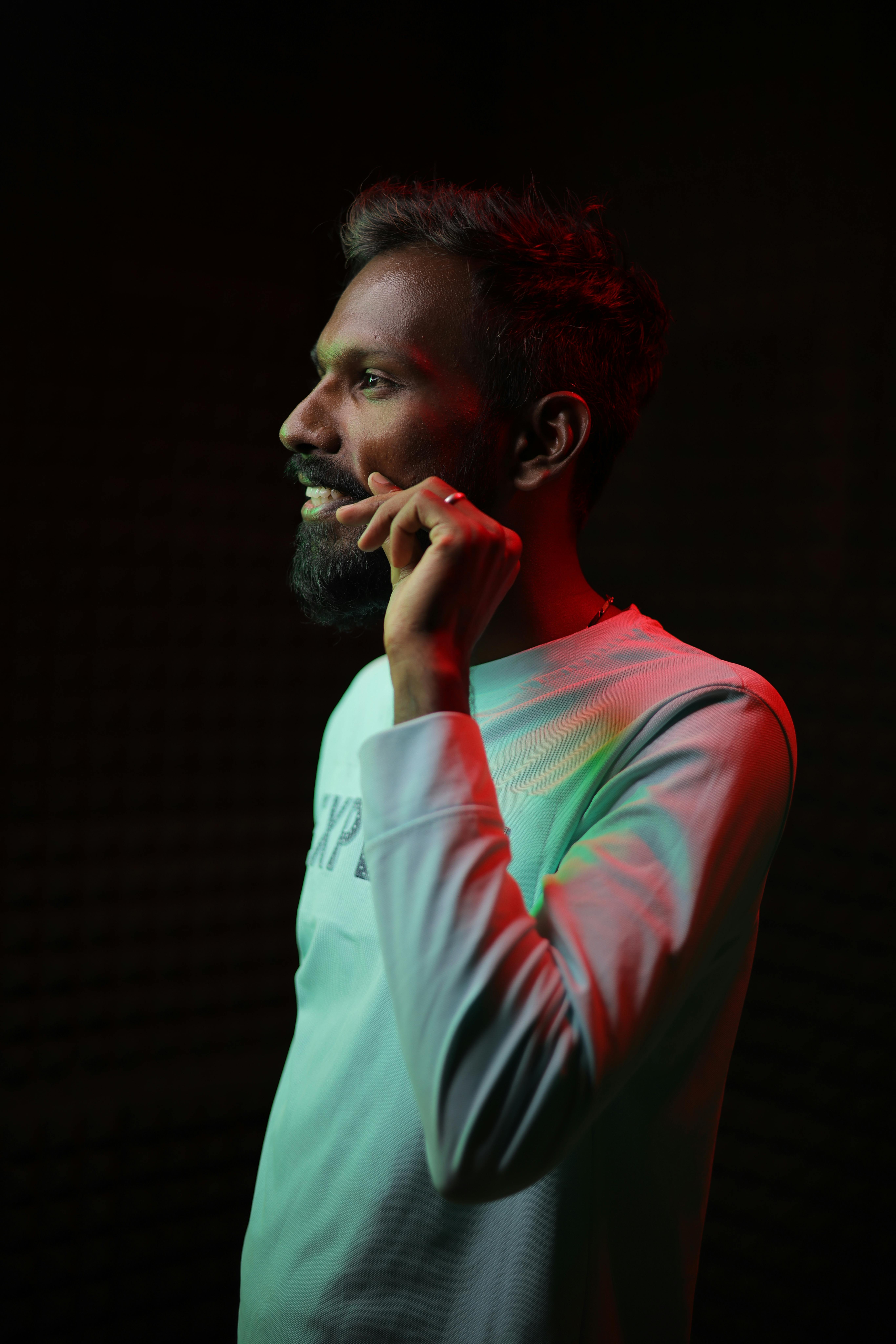 Smiling Man Fixing Mustache · Free Stock Photo