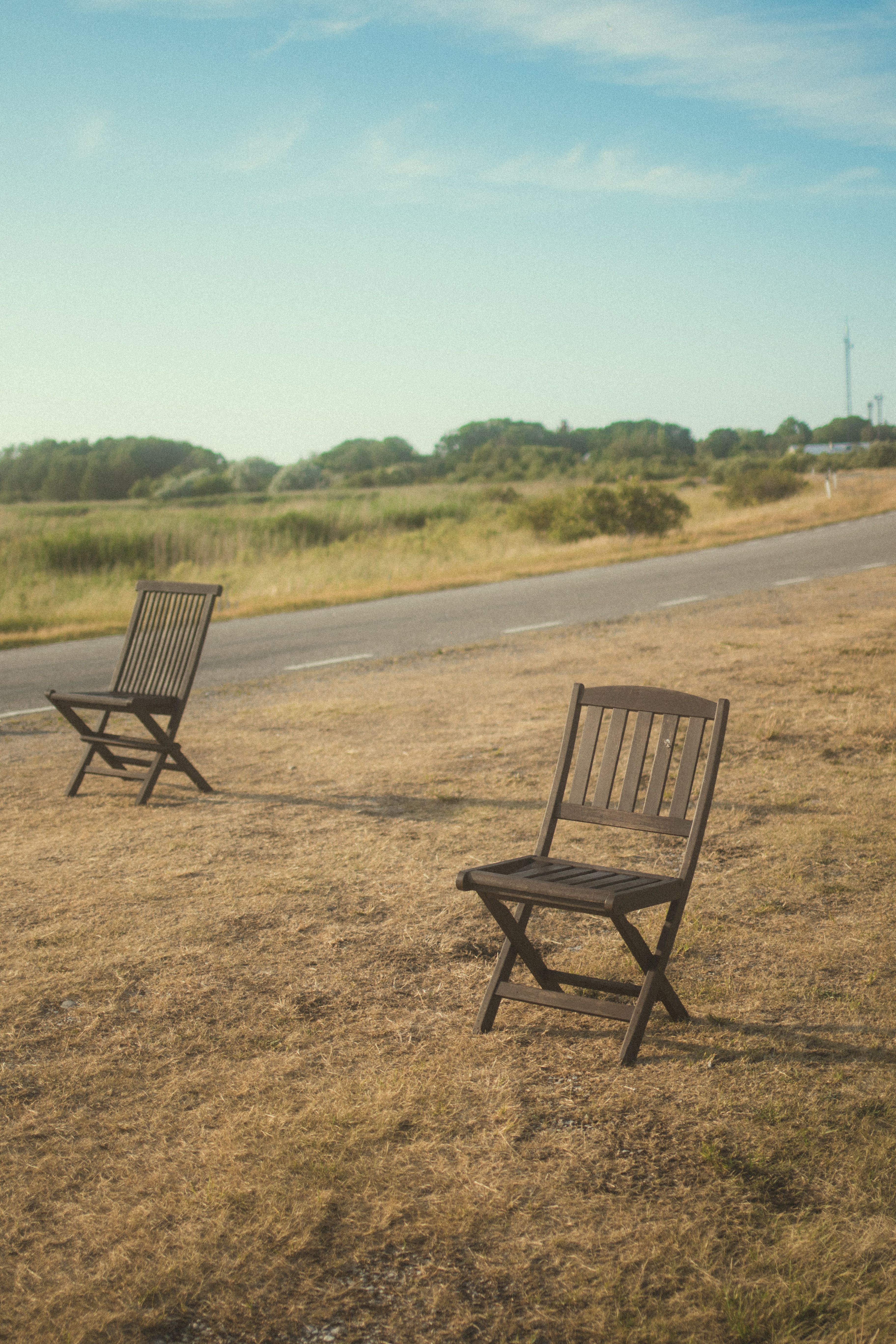 Wooden Chairs near Road in Countryside · Free Stock Photo