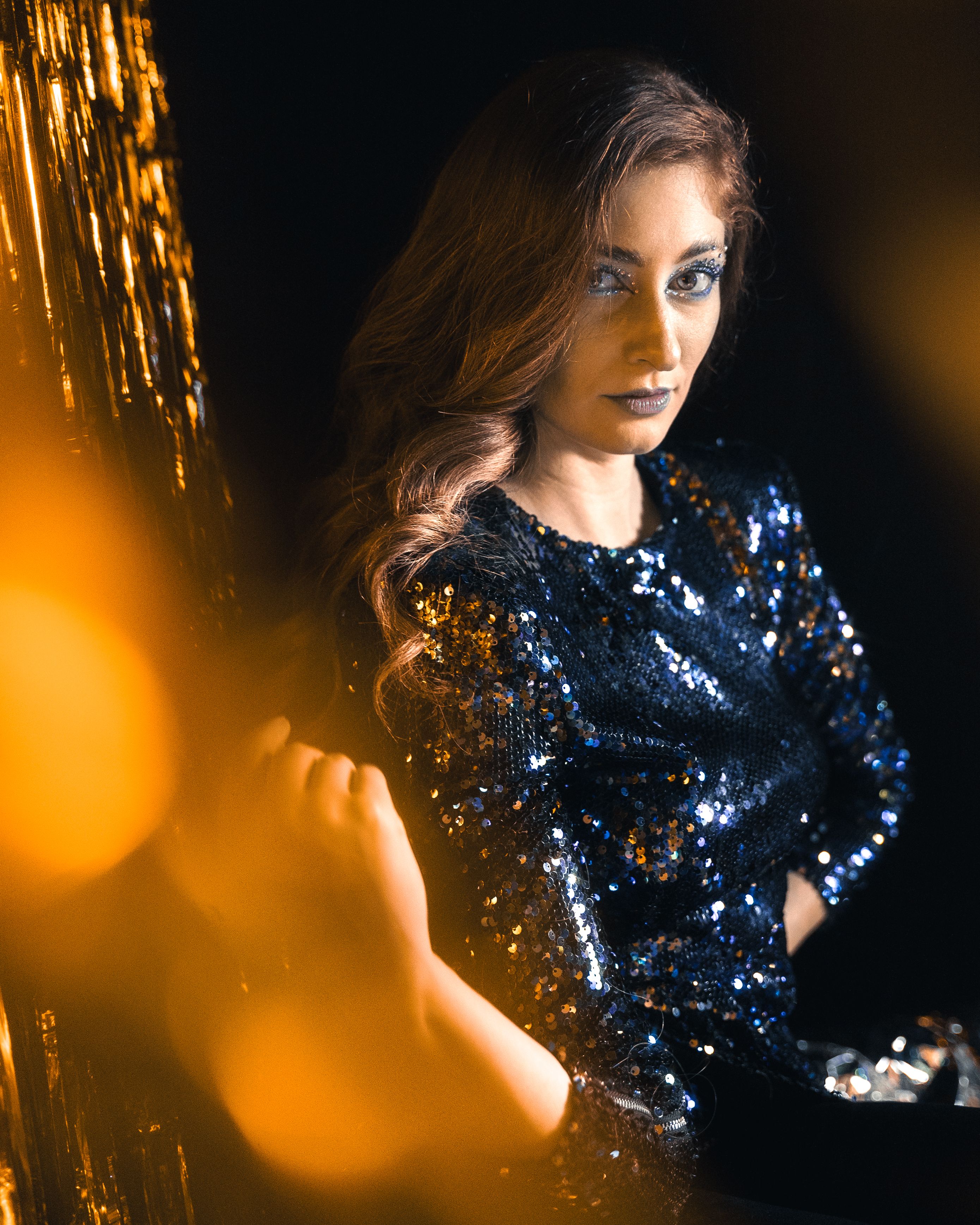 Model Posing in Glistening Dress · Free Stock Photo