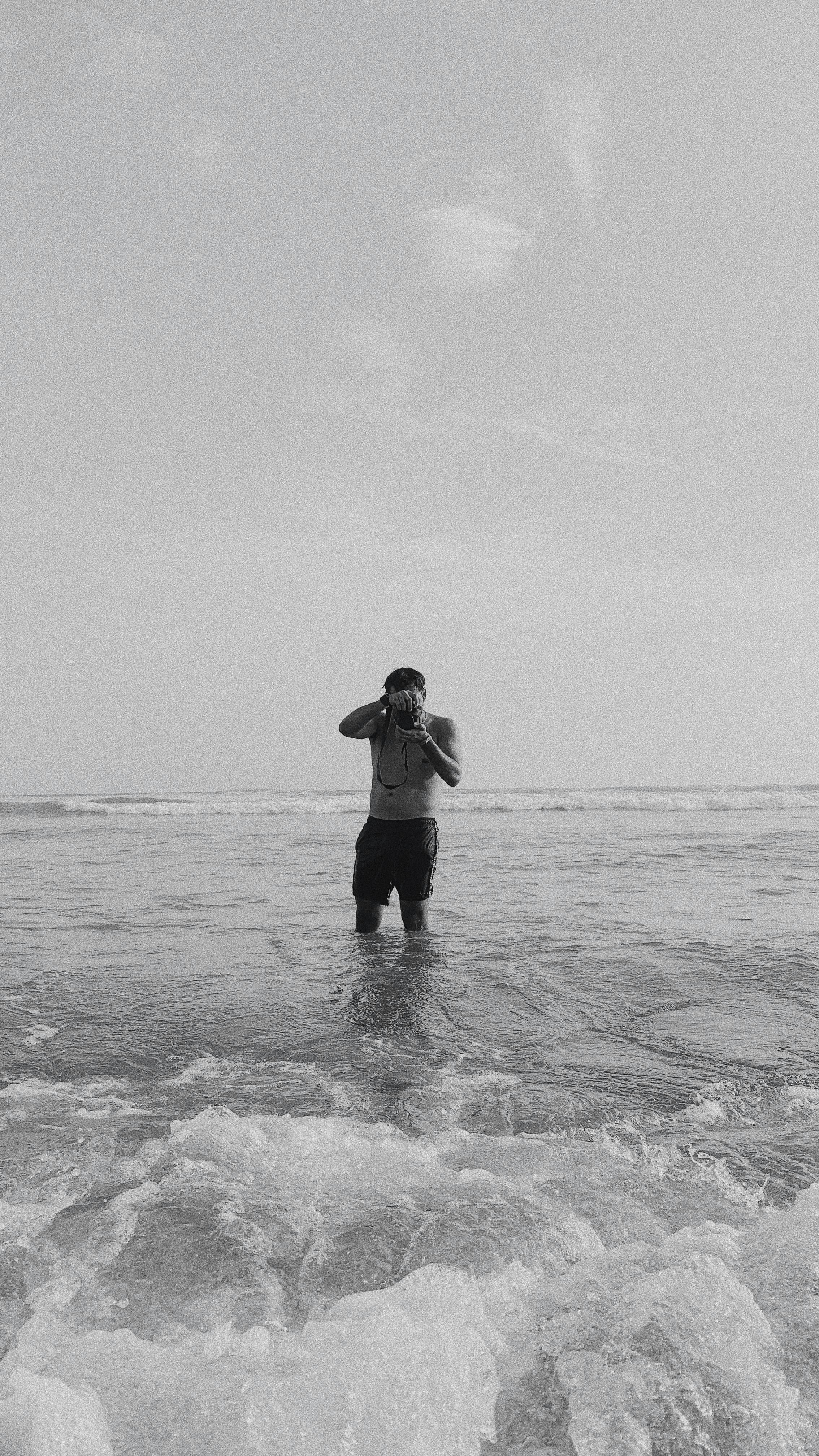 Photographer Taking Photos of Waves While Wading in the Sea · Free ...