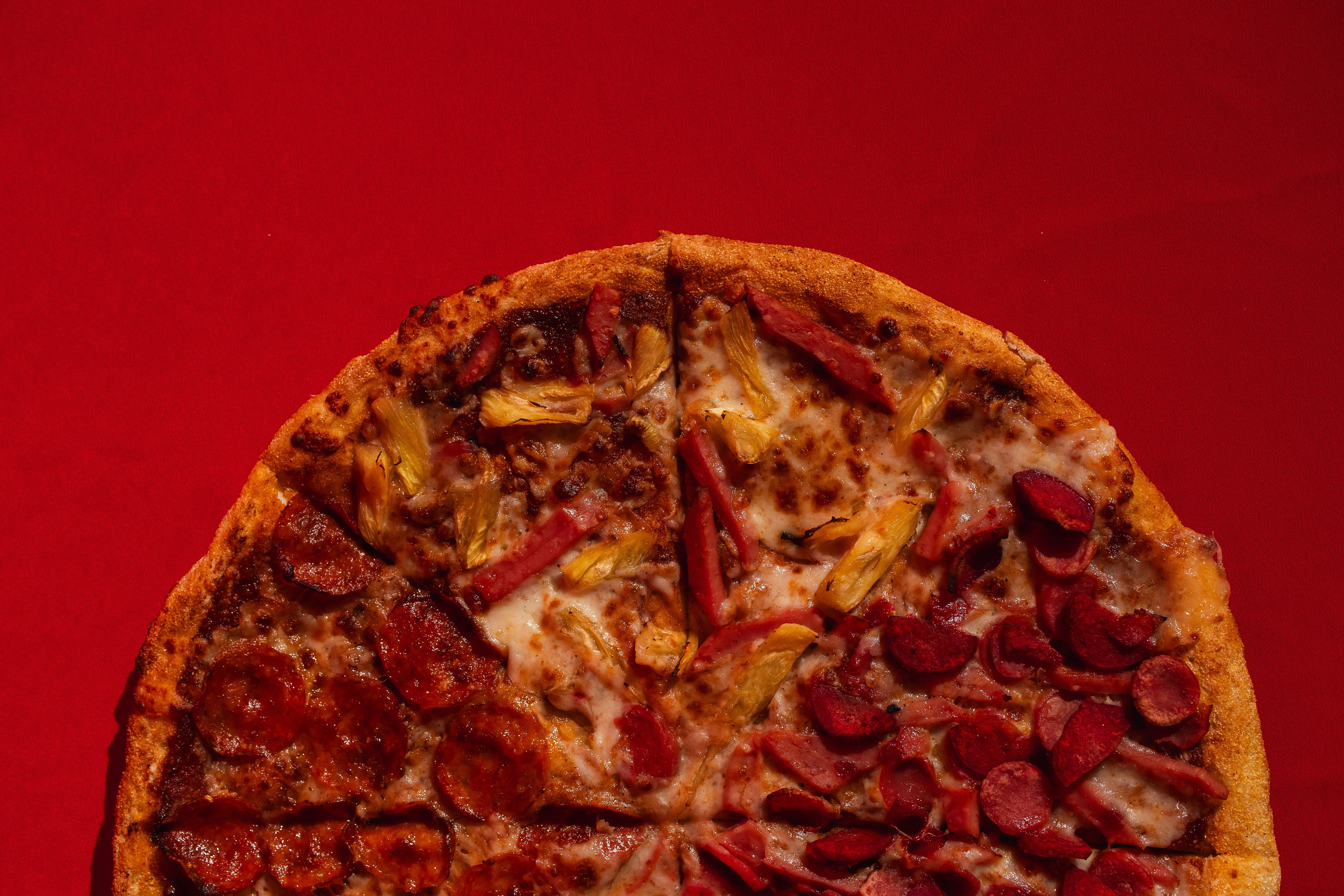 Slices of Pizza with Various Toppings · Free Stock Photo